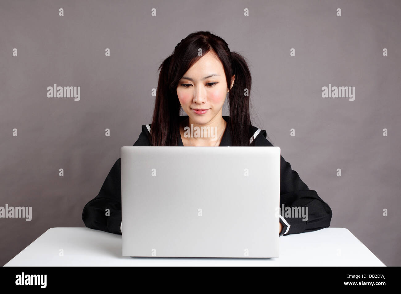 School girl is using computer Stock Photo - Alamy
