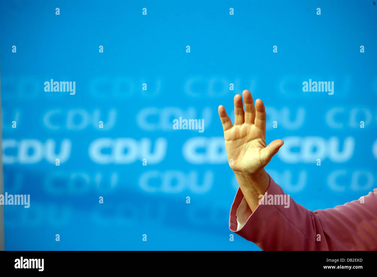 Binz, Germany. 22nd July, 2013. German Chancellor Angela Merkel (CDU, C) waves at tourists and ...