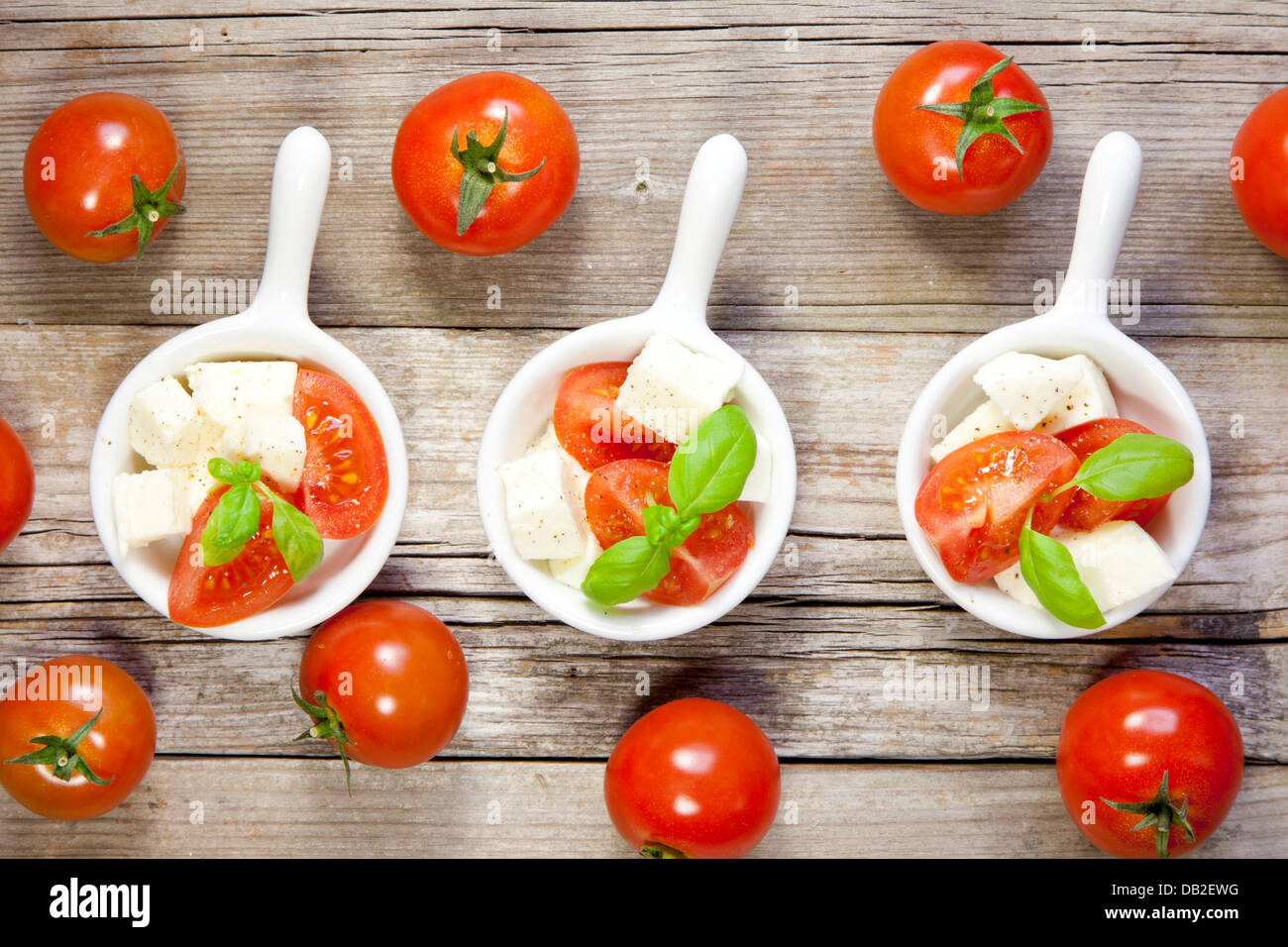 Italian salad on rustic wood Stock Photo - Alamy