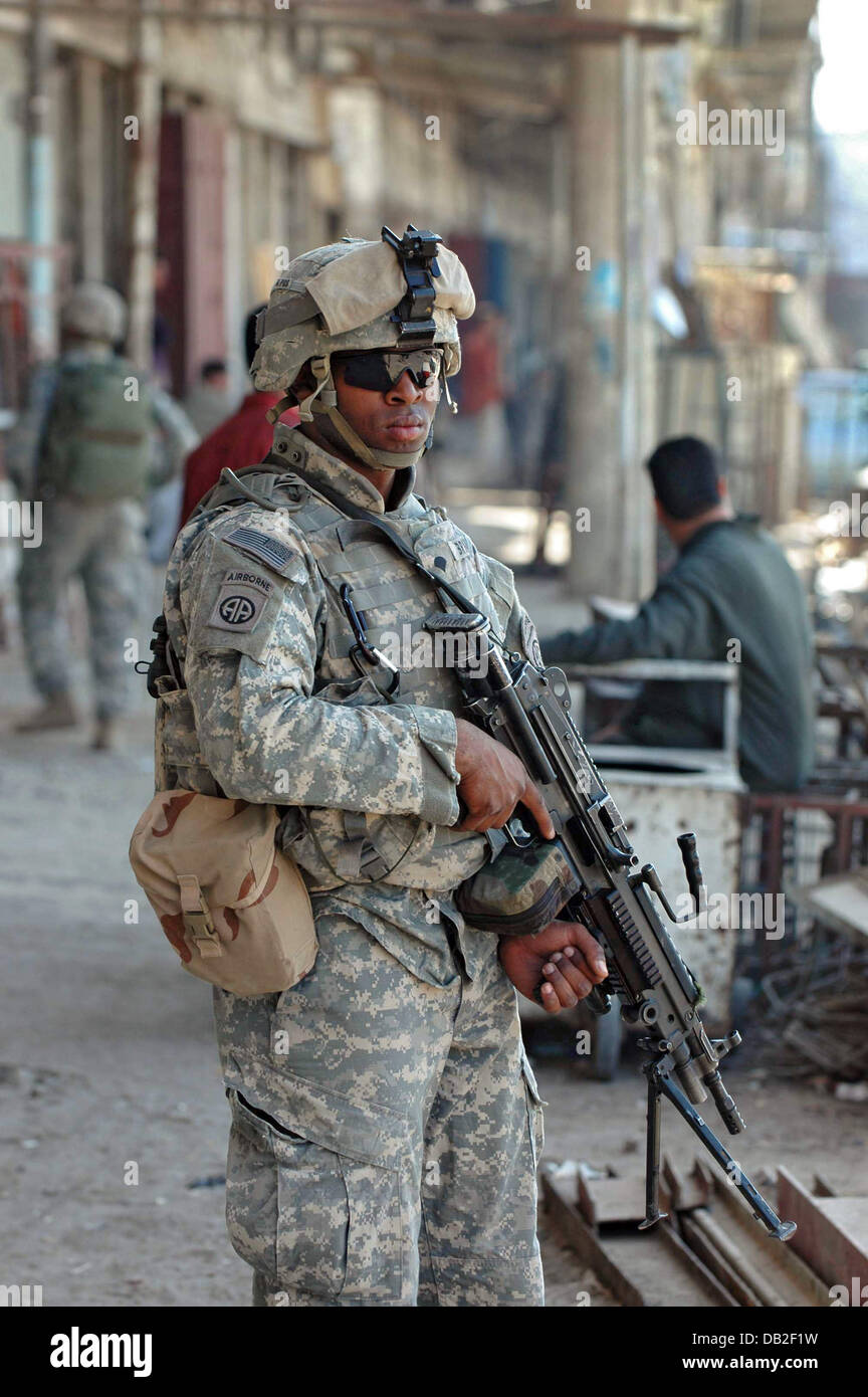 A paratrooper stands guard with his M4A1 carbine during a patrol in ...