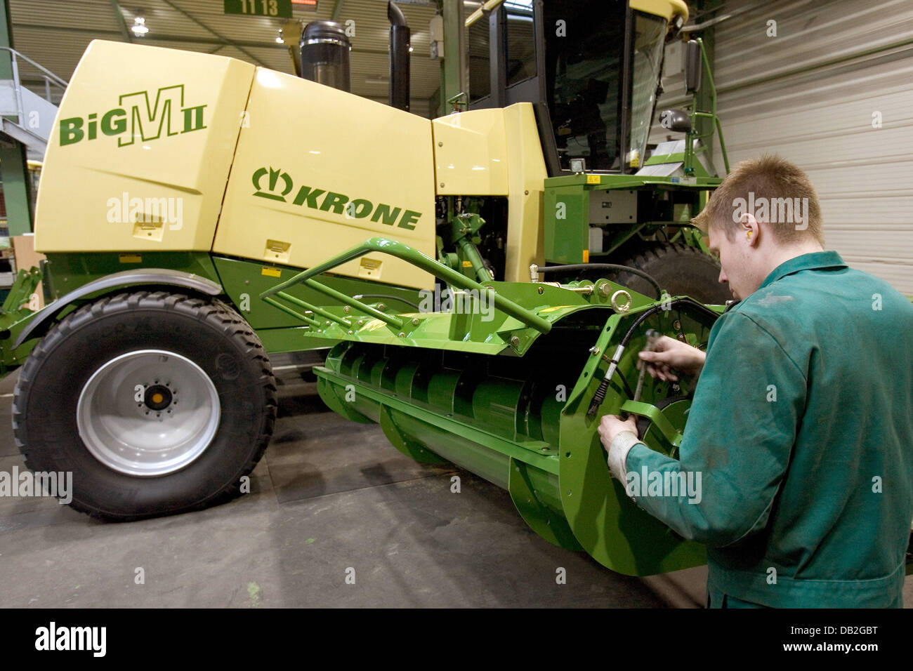 A worker assembles 'Big M' tractors at a plant of the machine producer ...
