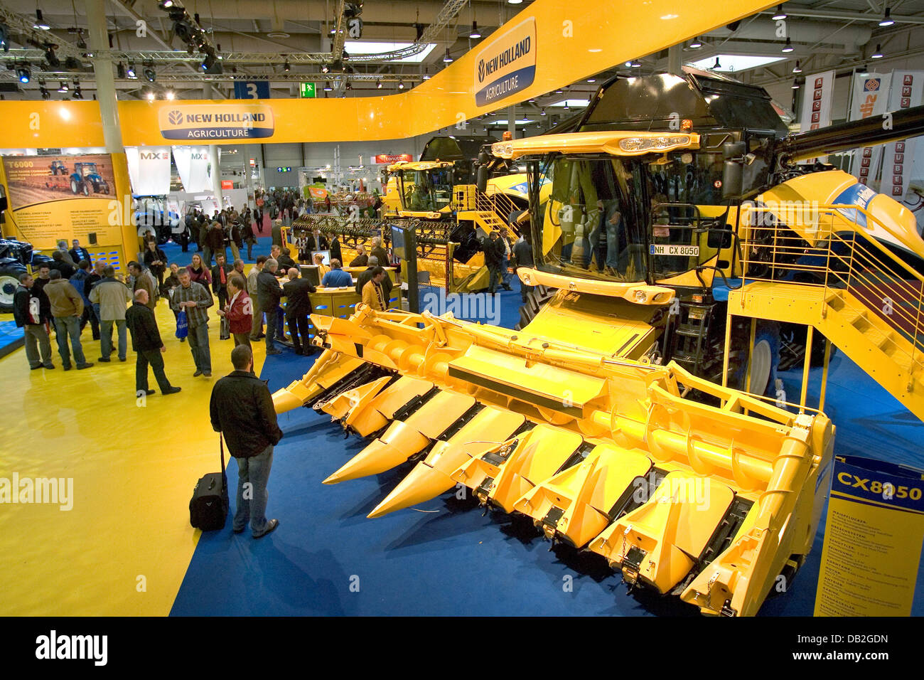 Visitors look at combine harvester and other state-of-the-art farm ...