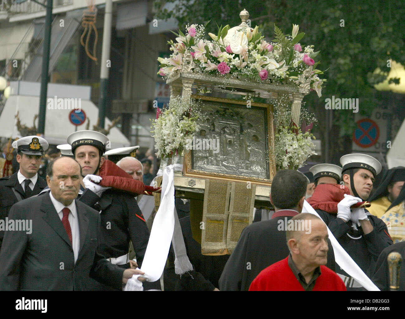 Sailors carry a sacred picture during a Greek Orthodox procession at ...