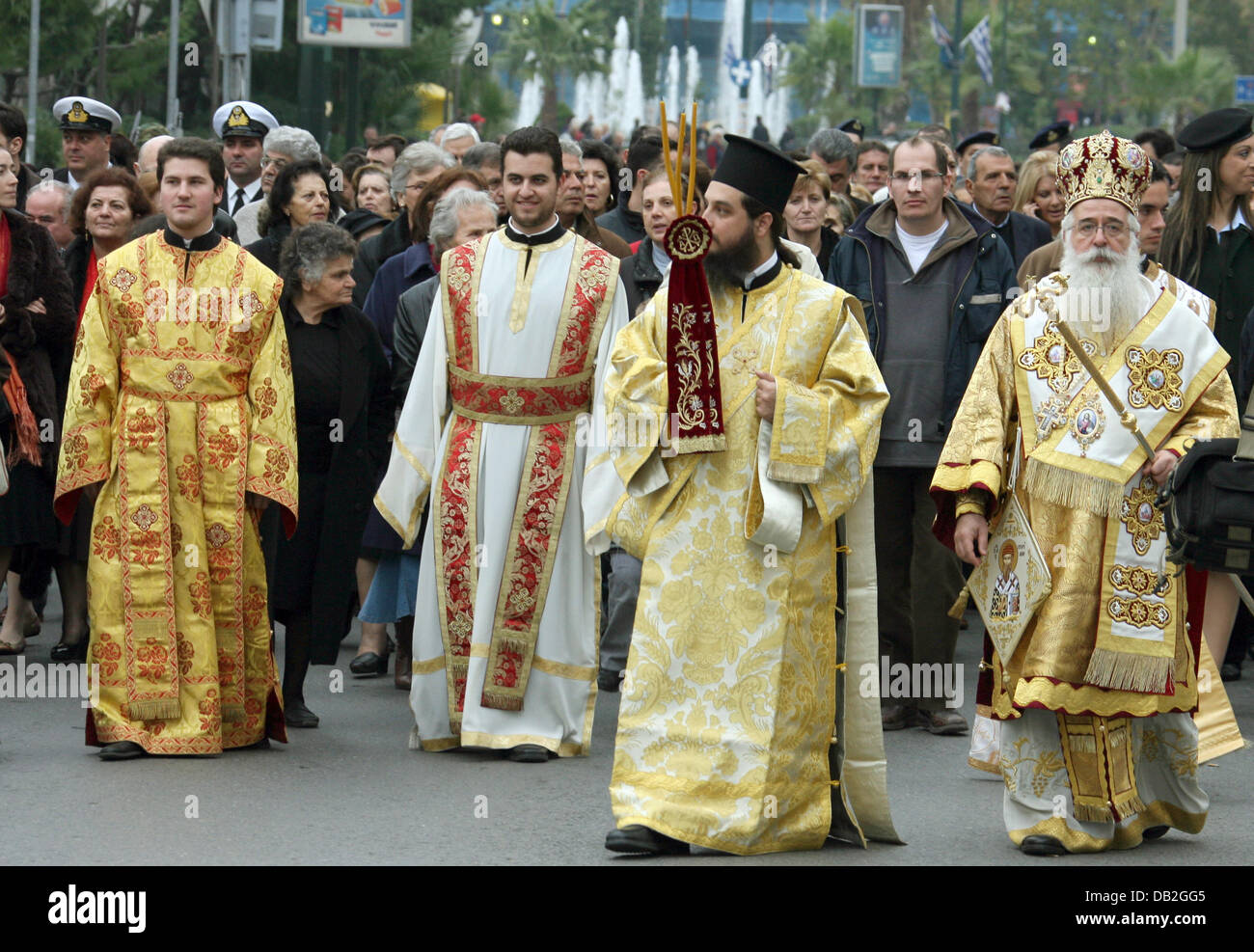 Priests are pictured during a Greek Orthodox procession at the harbour ...