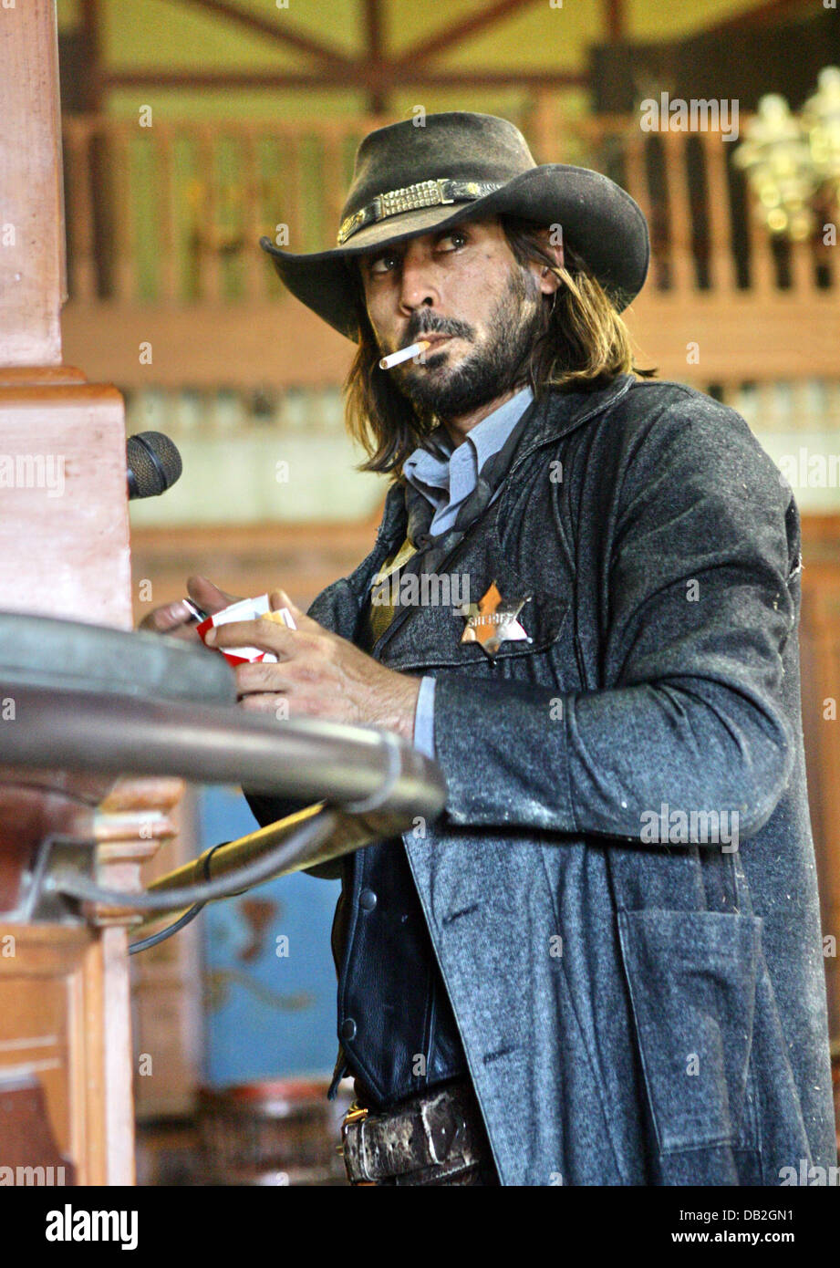 Stuntman Fernando Manzano performs for tourists visiting western style ...