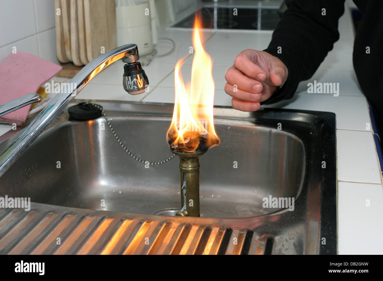 A candlestick caught fire and is placed into the sink for safety ...