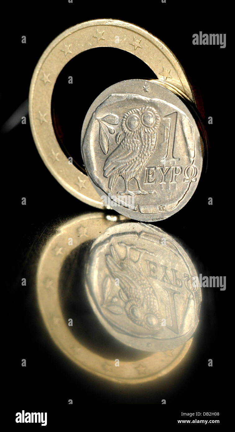 ILLUSTRATION - A broken euro coin from Greece is pictured in Hanover ...