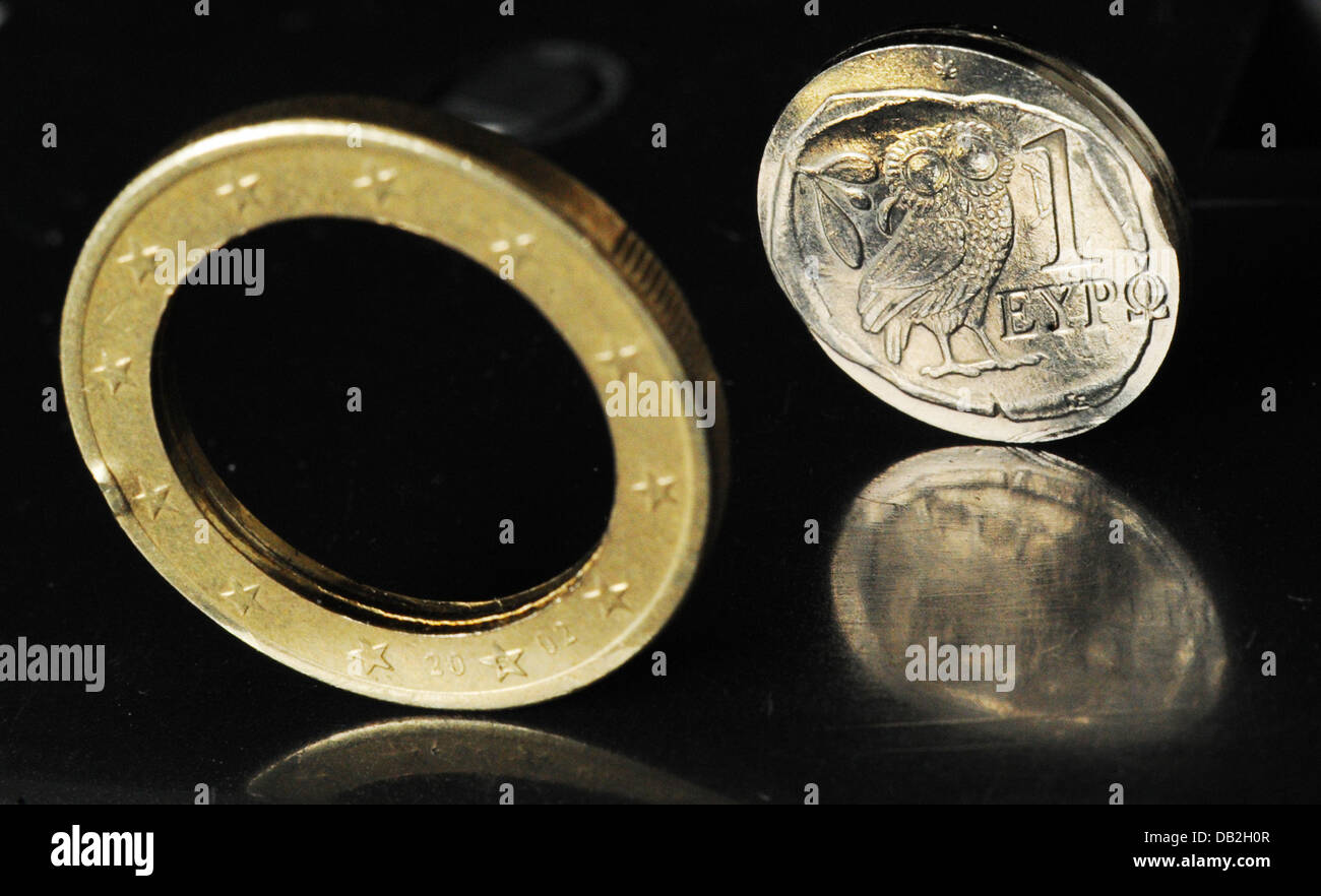 ILLUSTRATION - A broken euro coin from Greece is pictured in Hanover ...