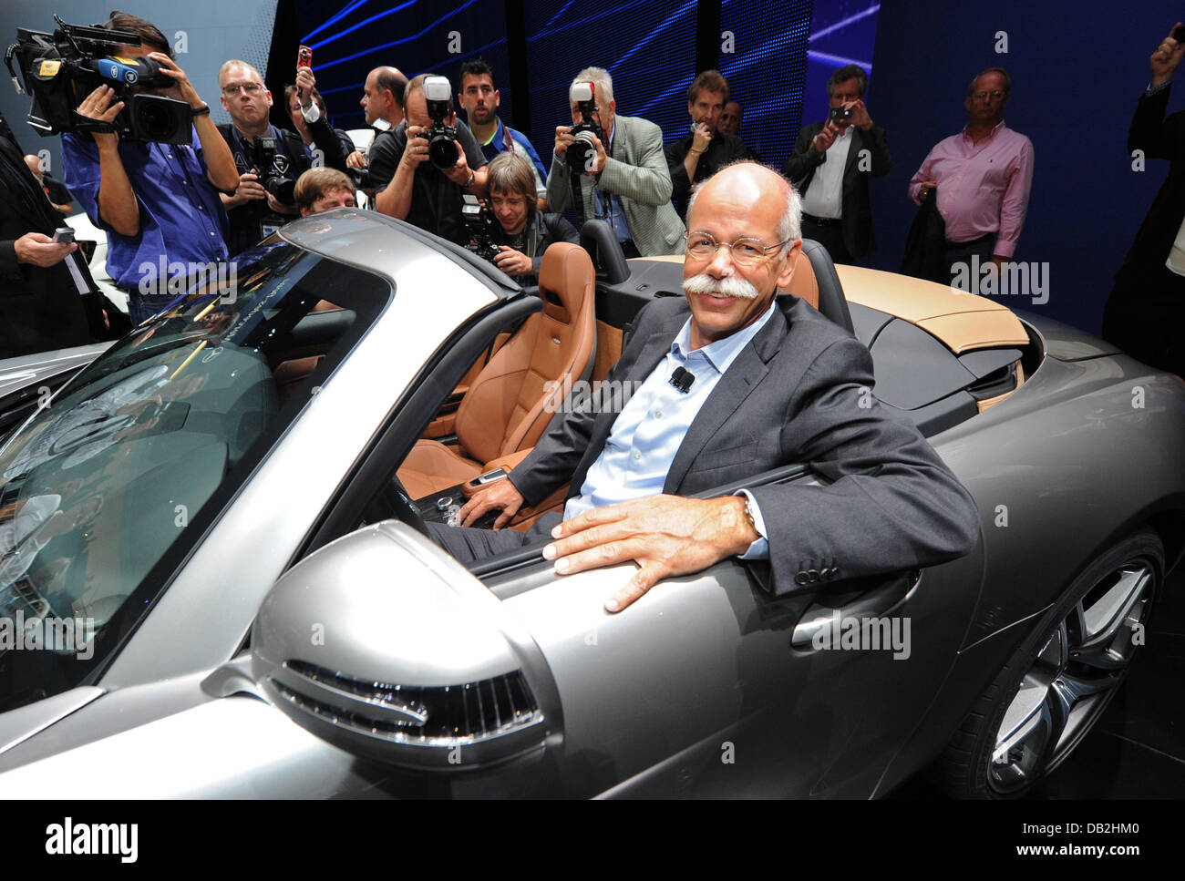 Chairman of Daimler AG, Dieter Zetsche, sits inside a Mercedes Benz SLS ...
