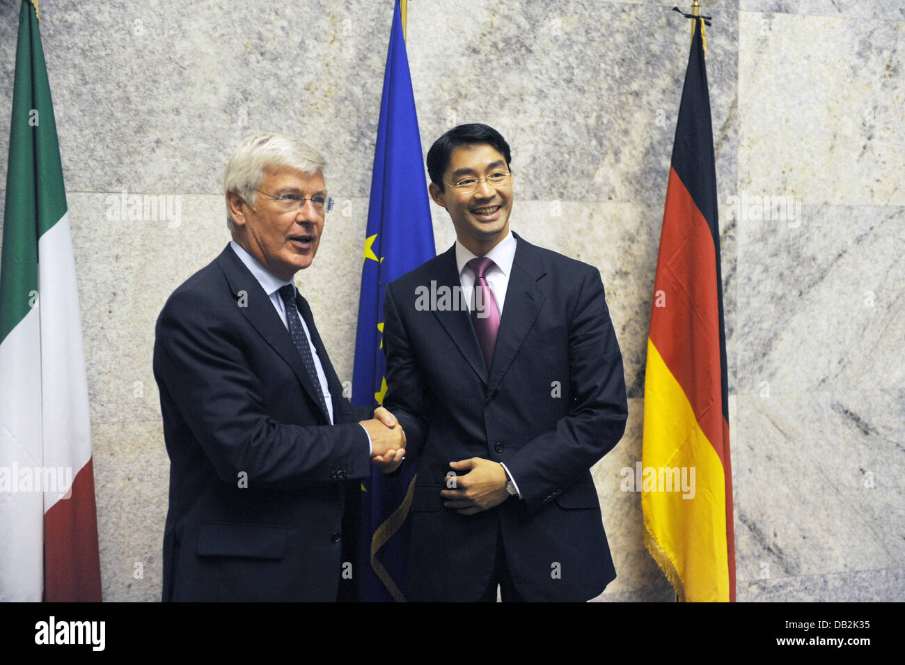 German Minister for Economic Affairs Philipp Roesler (r) and the ...
