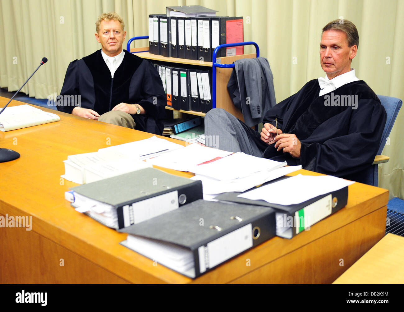The prosecutors Andreas Miller (R) and Guenther Hammerdinger sit inside ...