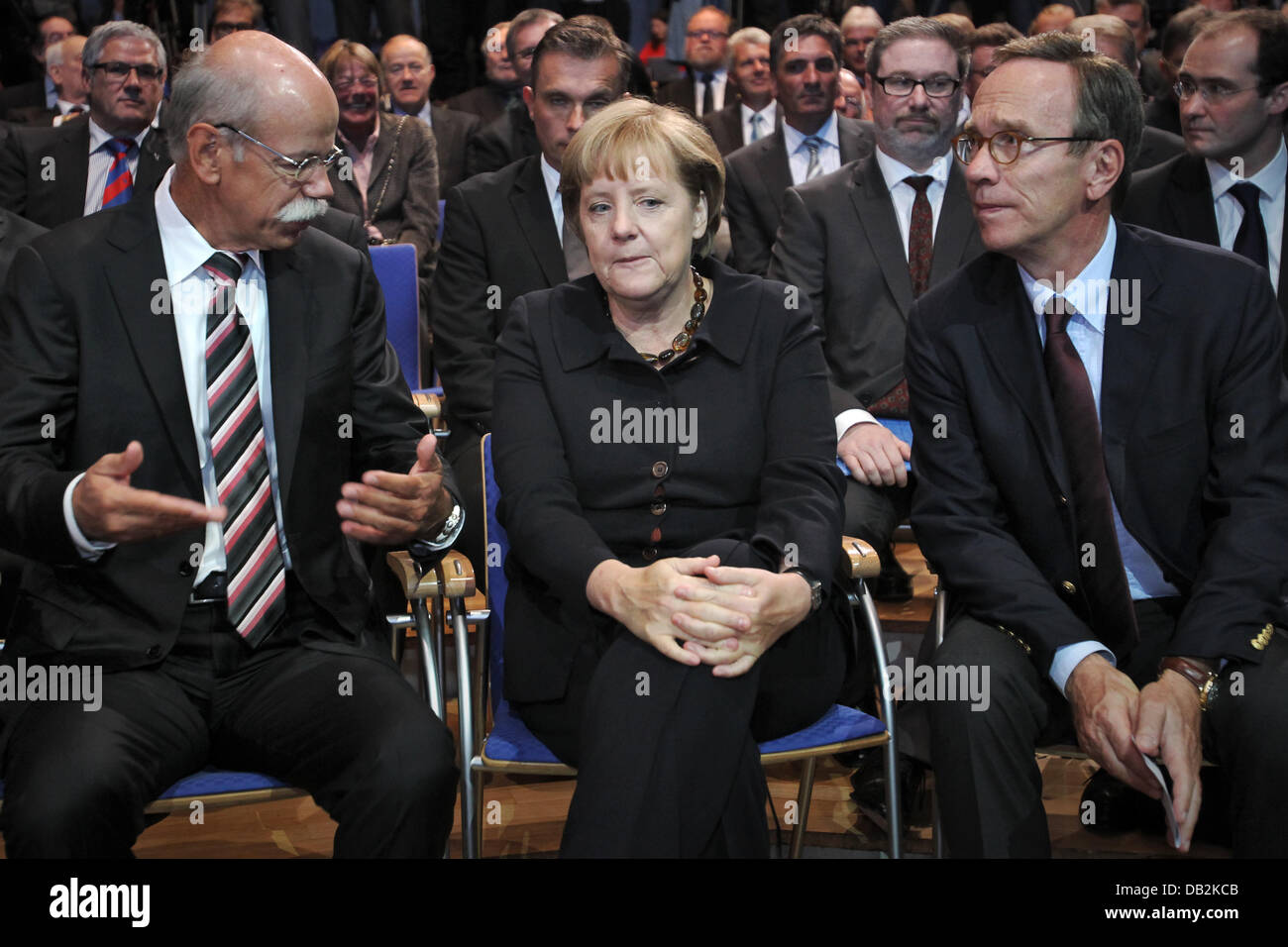 German Chancellor Angela Merkel (C) visits the International Motor Show ...