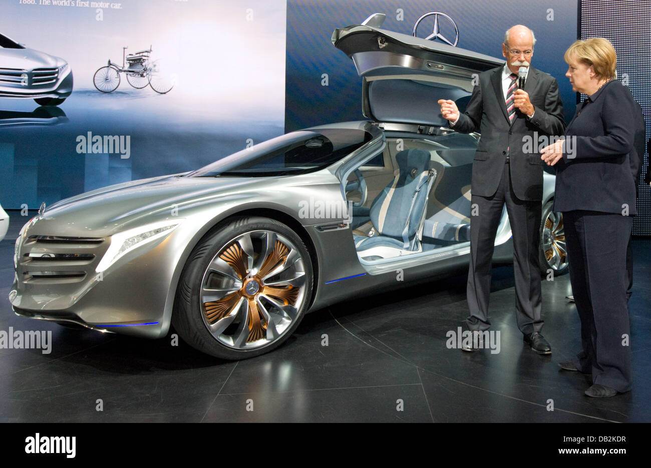 German chancellor Angela Merkel (R) and chairman of Mercedes Dieter ...
