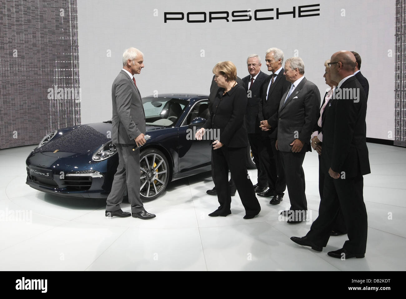 German chancellor Angela Merkel (2-L) and Porsche chairman Matthias ...
