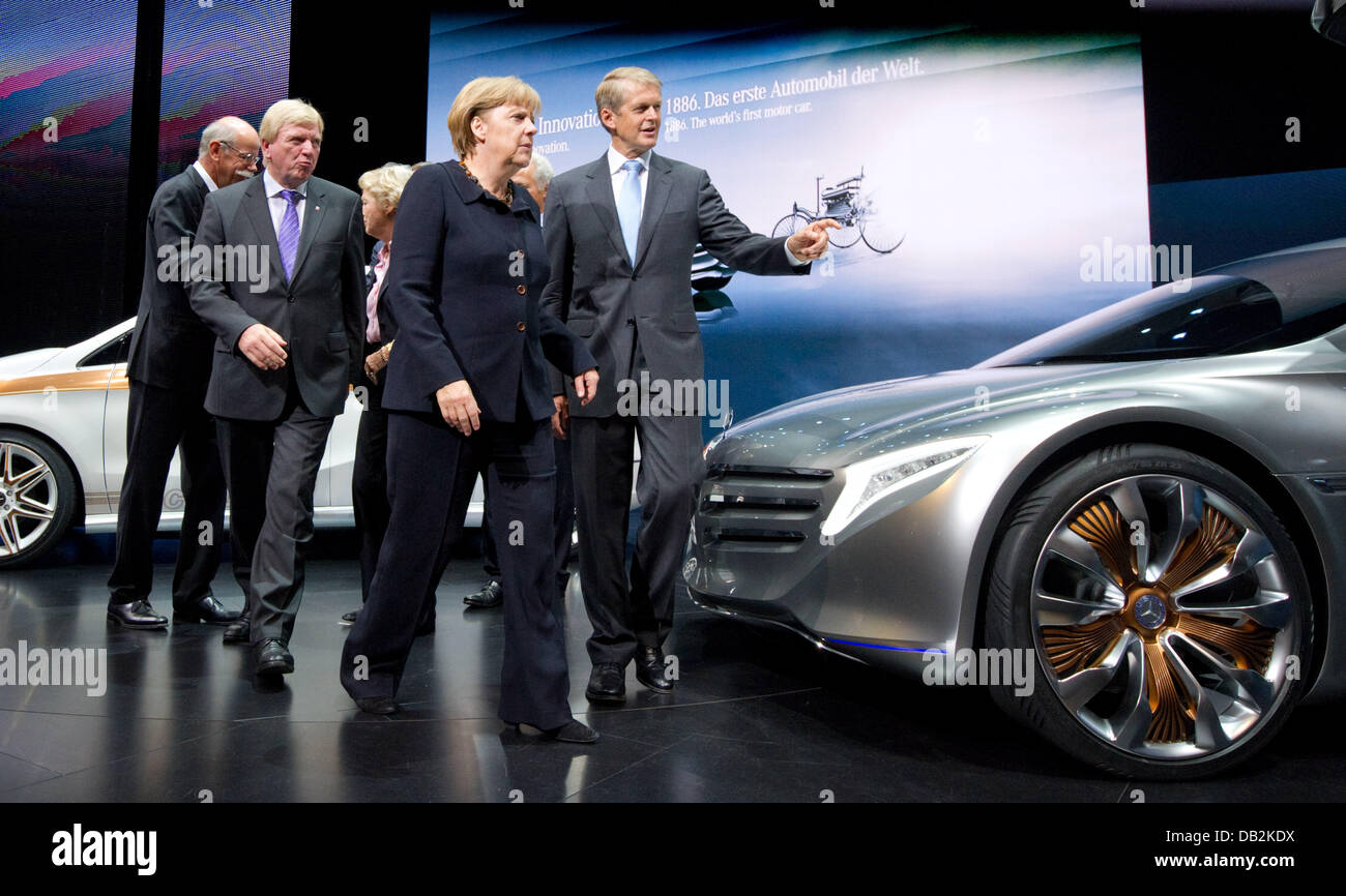 German chancellor Angela Merkel and Mercedes member of the board Thomas ...