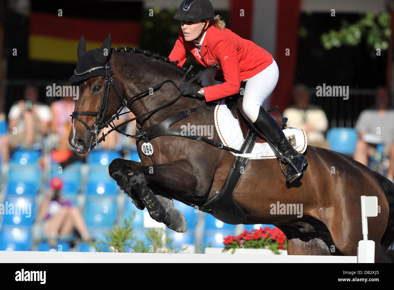 German show jumper Janne-Friederike Meyer jumps over an obstacle on her ...