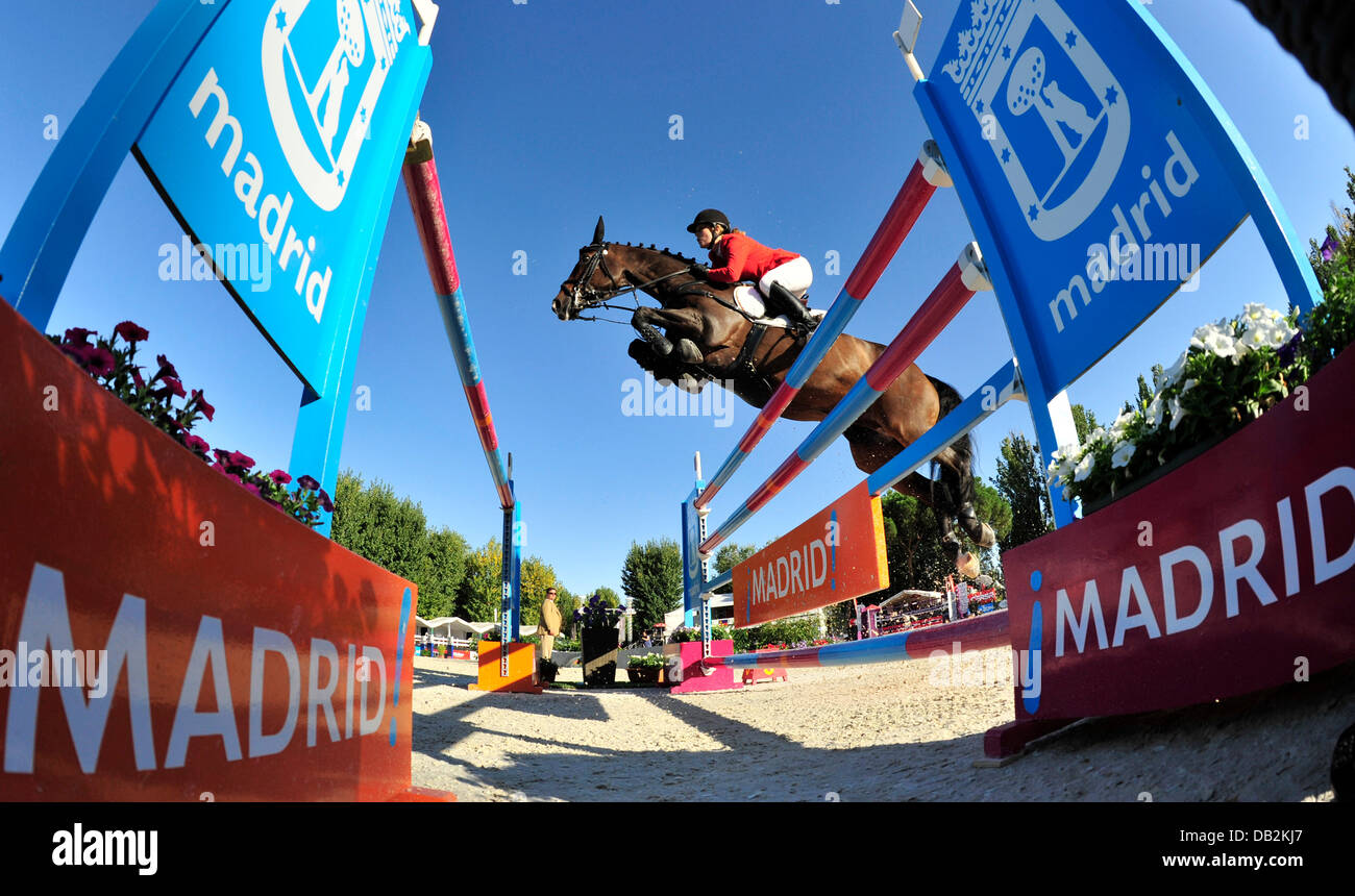 German show jumper Janne-Friederike Meyer jumps over an obstacle on her ...