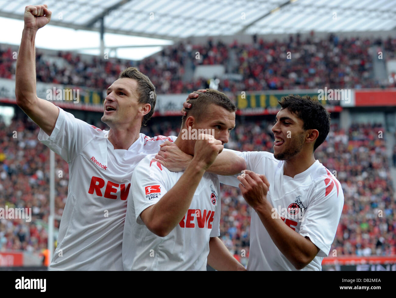 Cologne's Milivoje Novakovic celebrates his 1-0 goal with Lukas ...