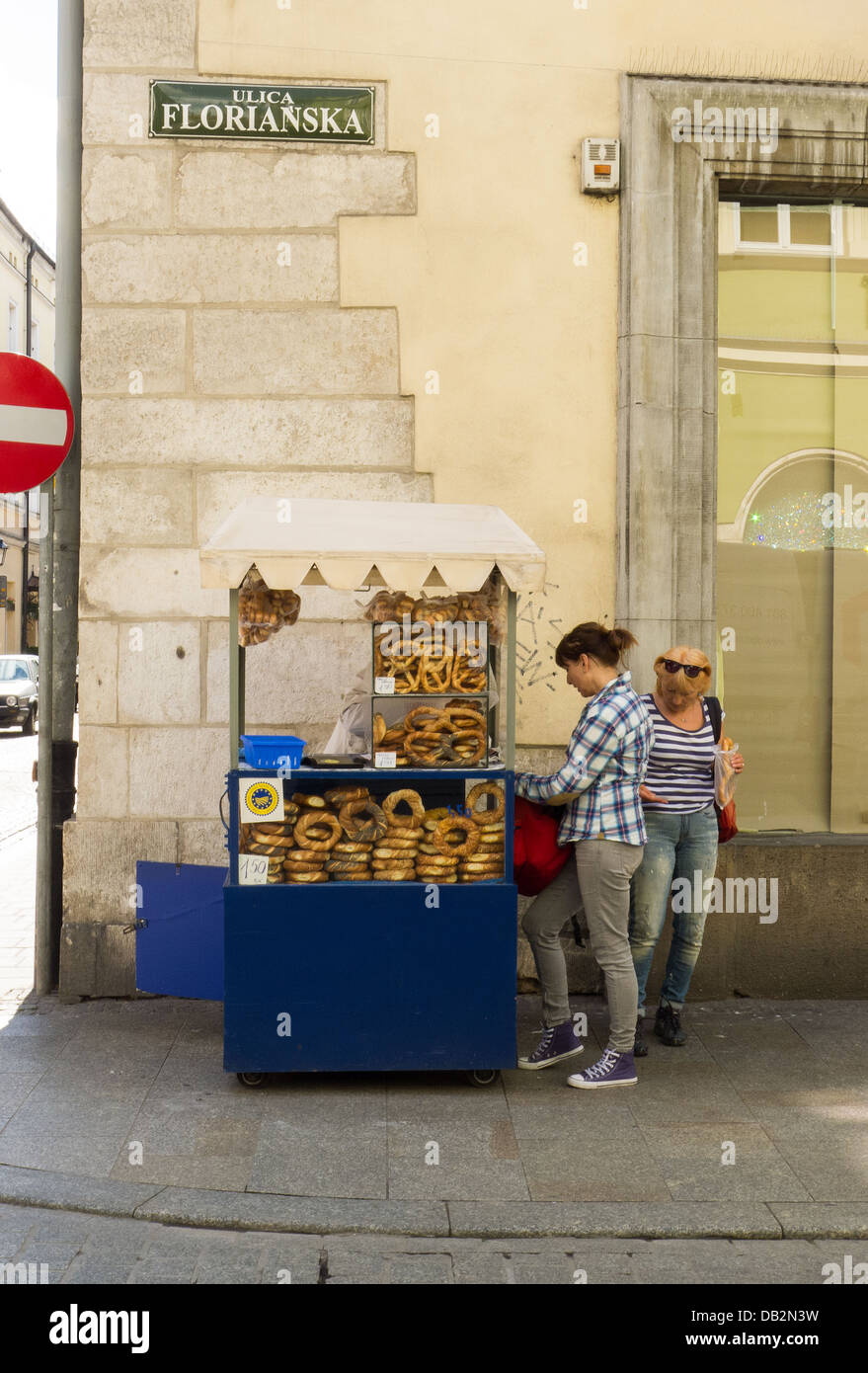 Pretzel stall and vendor trading on a street in Krakow in Poland Stock ...