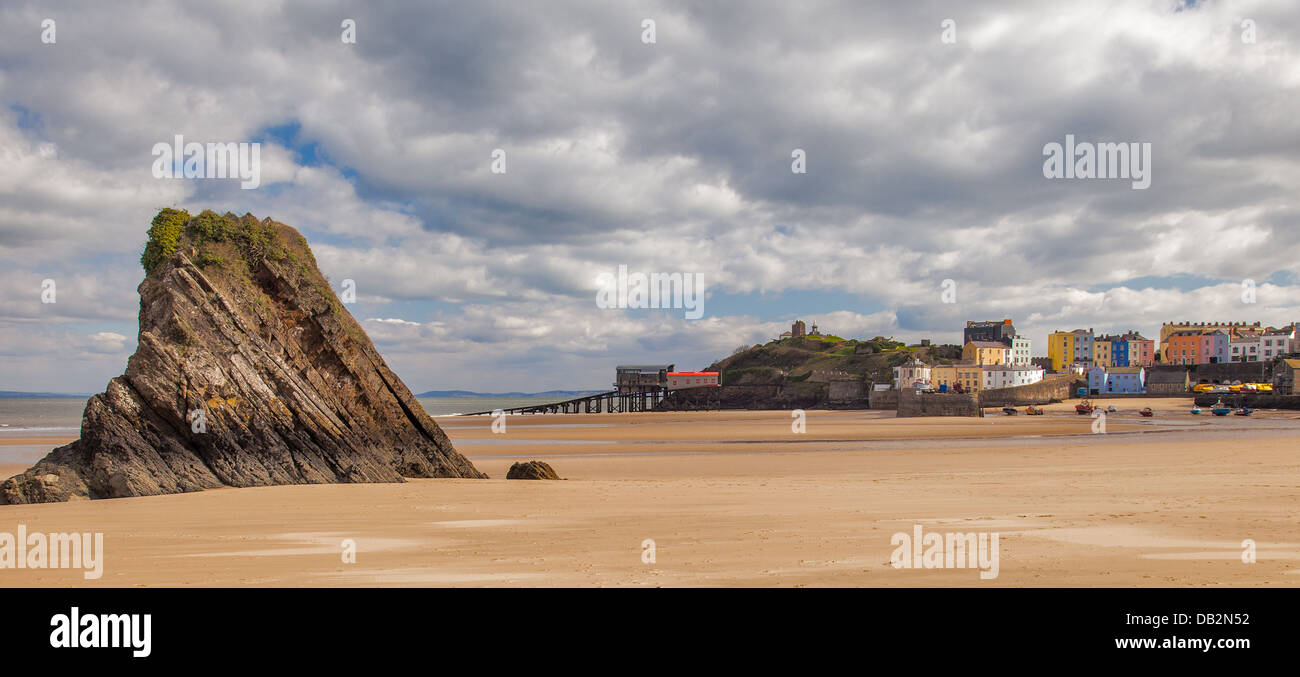 A view of Goskar Rock on North Beach at Tenby showing the harbour ...
