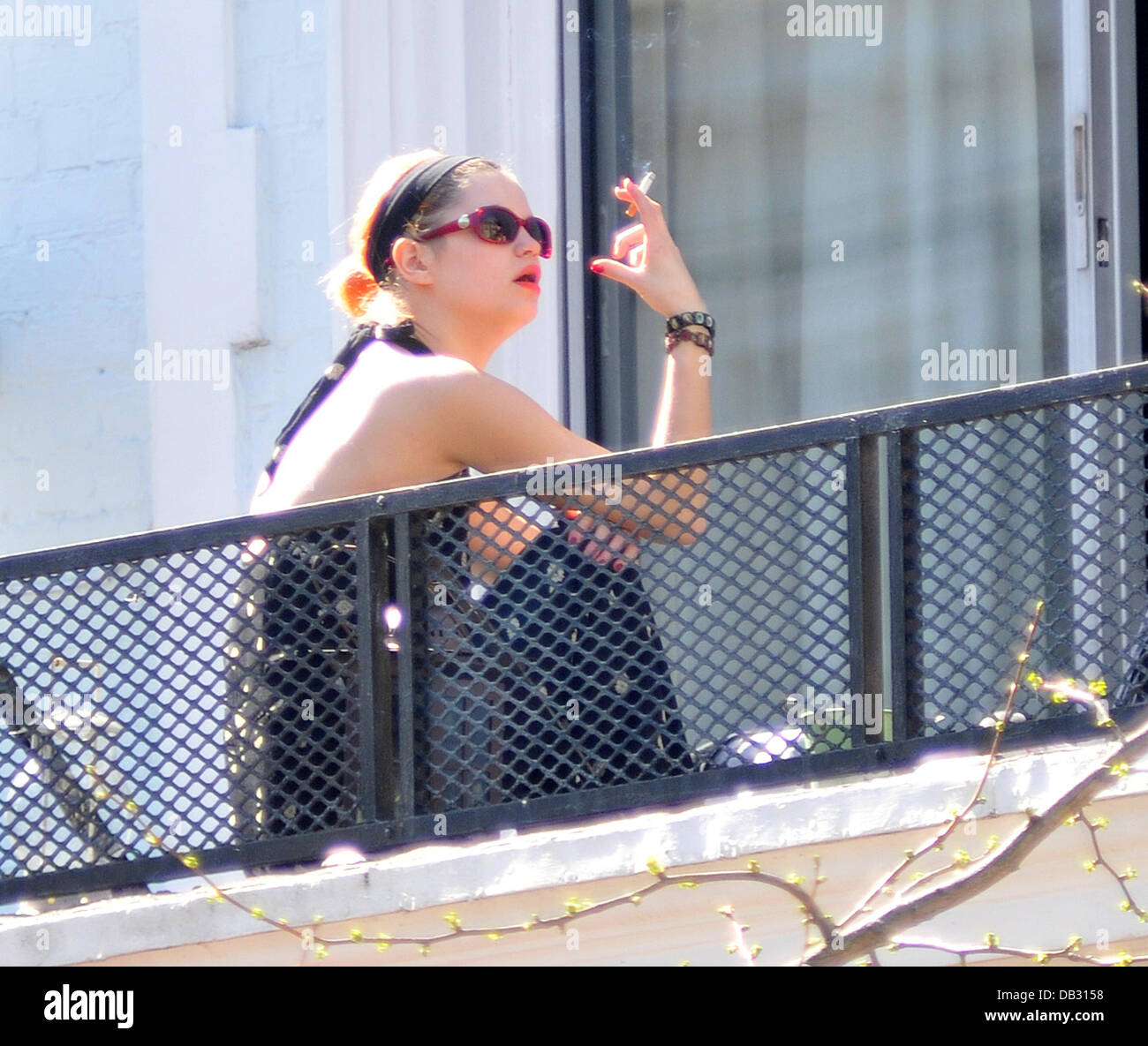 Pixie Geldof smokes a cigarette on a balcony on a sunny day in Primrose ...