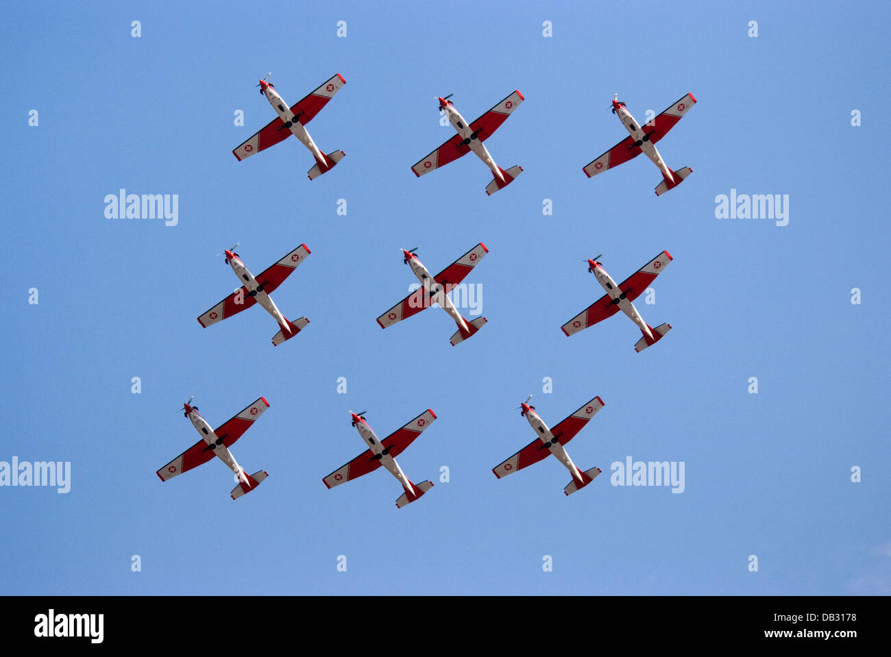 Red and White colors of the Swiss Aerial display team fly jn formation ...