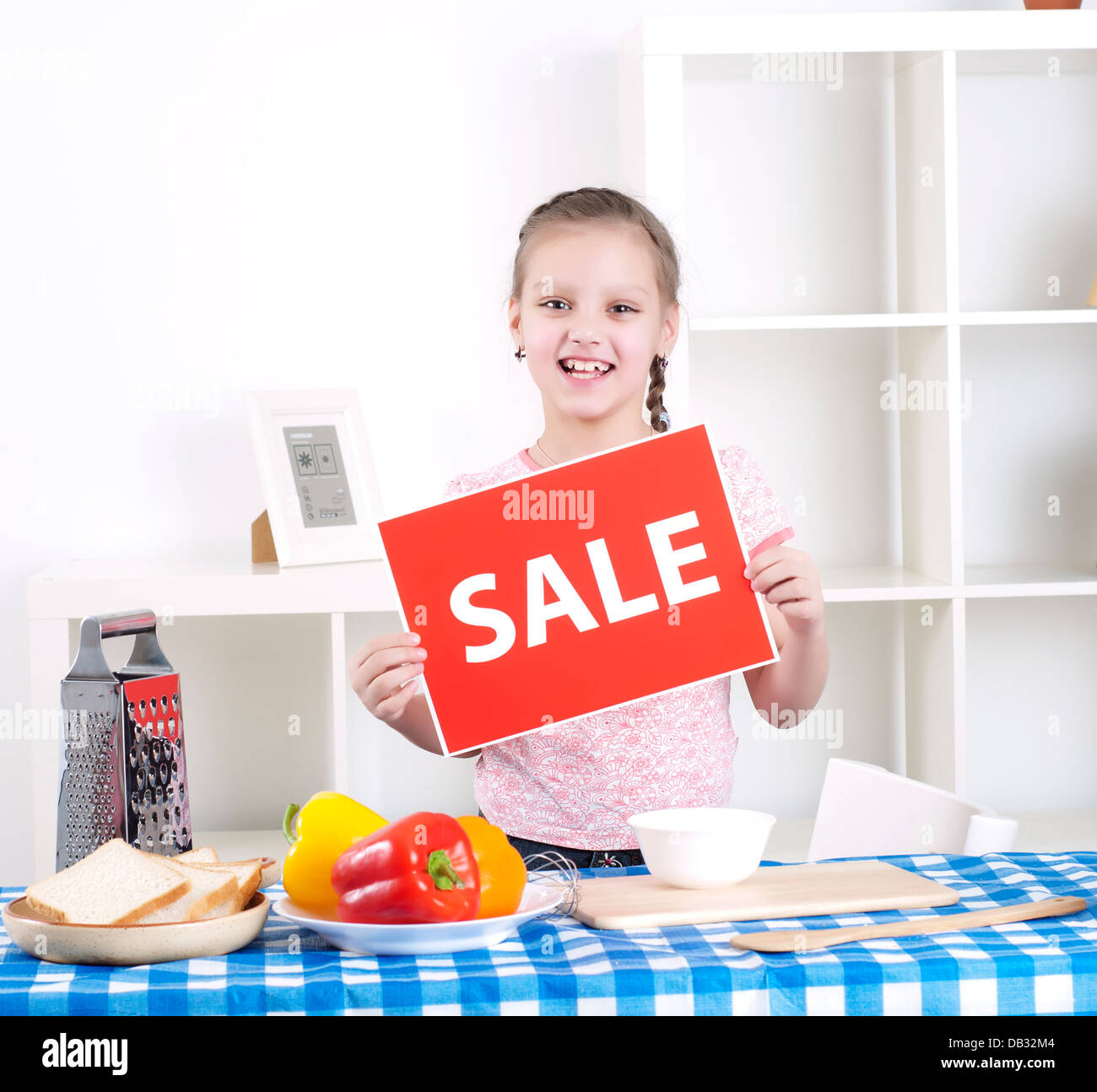 girl holding sale sign Stock Photo - Alamy