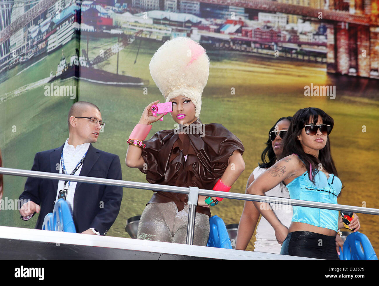 Nicki Minaj in Times Square on an open top double decker bus Casio ...