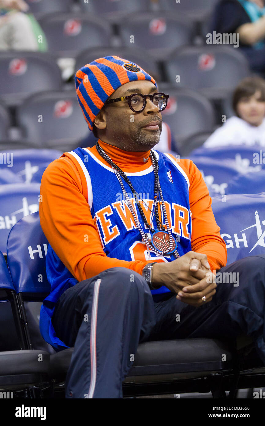 Spike Lee looks on from his courtside seat at the Prudential Center ...
