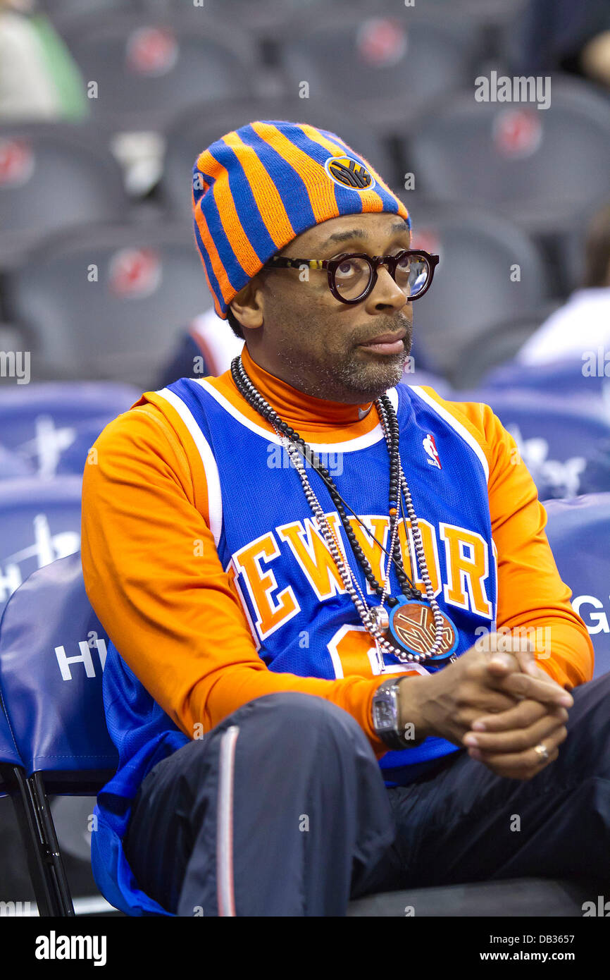 Spike Lee looks on from his courtside seat at the Prudential Center ...