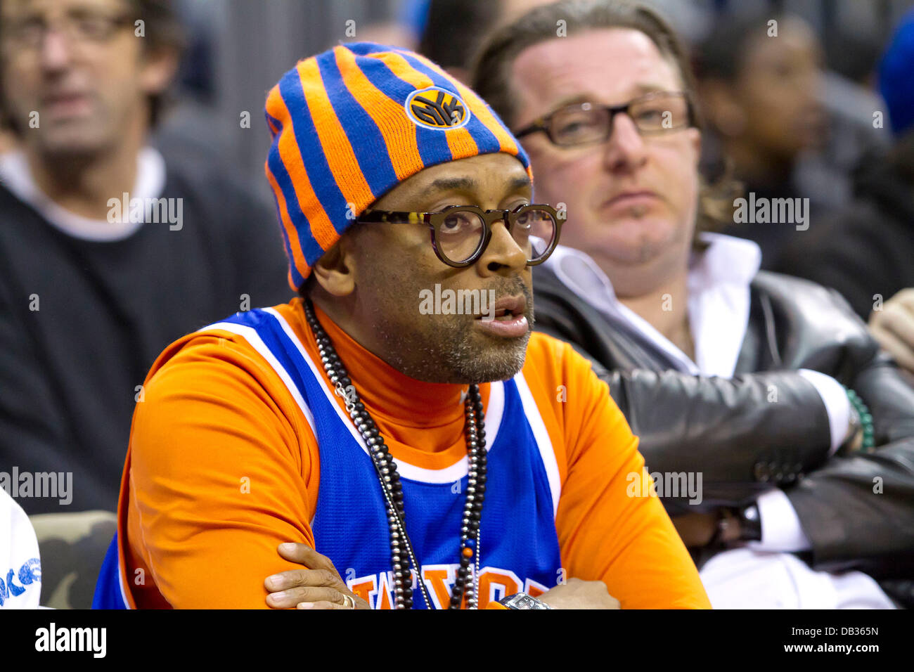 Spike Lee looks on from his courtside seat at the Prudential Center ...