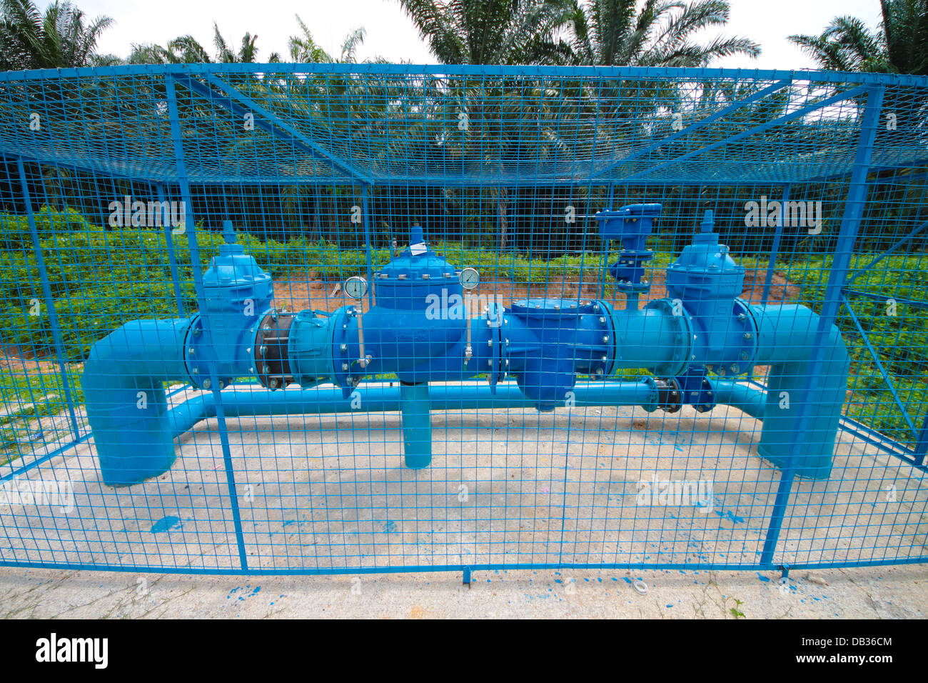 Water pipe inside locked cage Stock Photo - Alamy