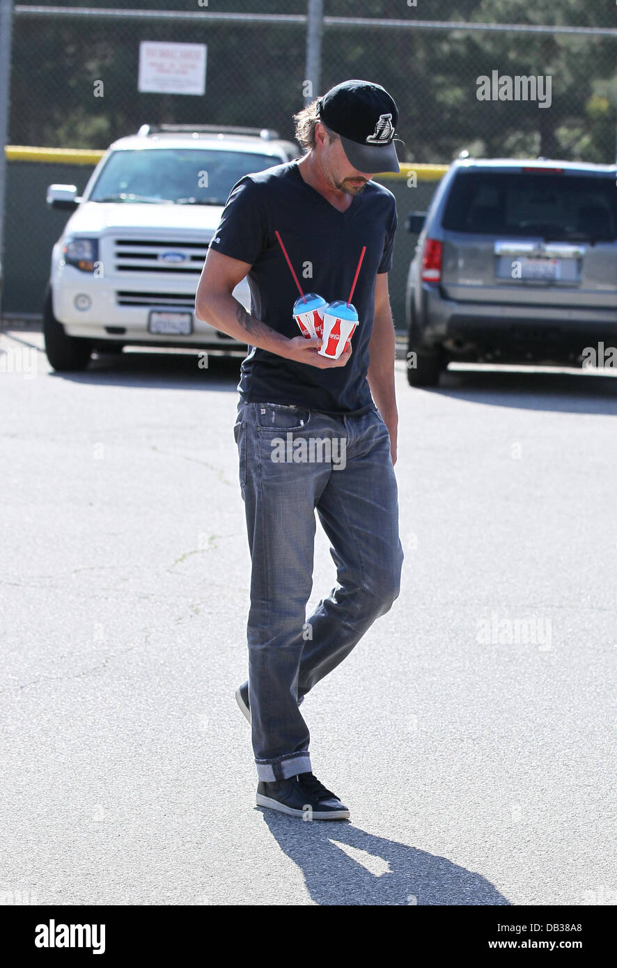 Jason Trawick returns to his car with some refreshments for himself and ...