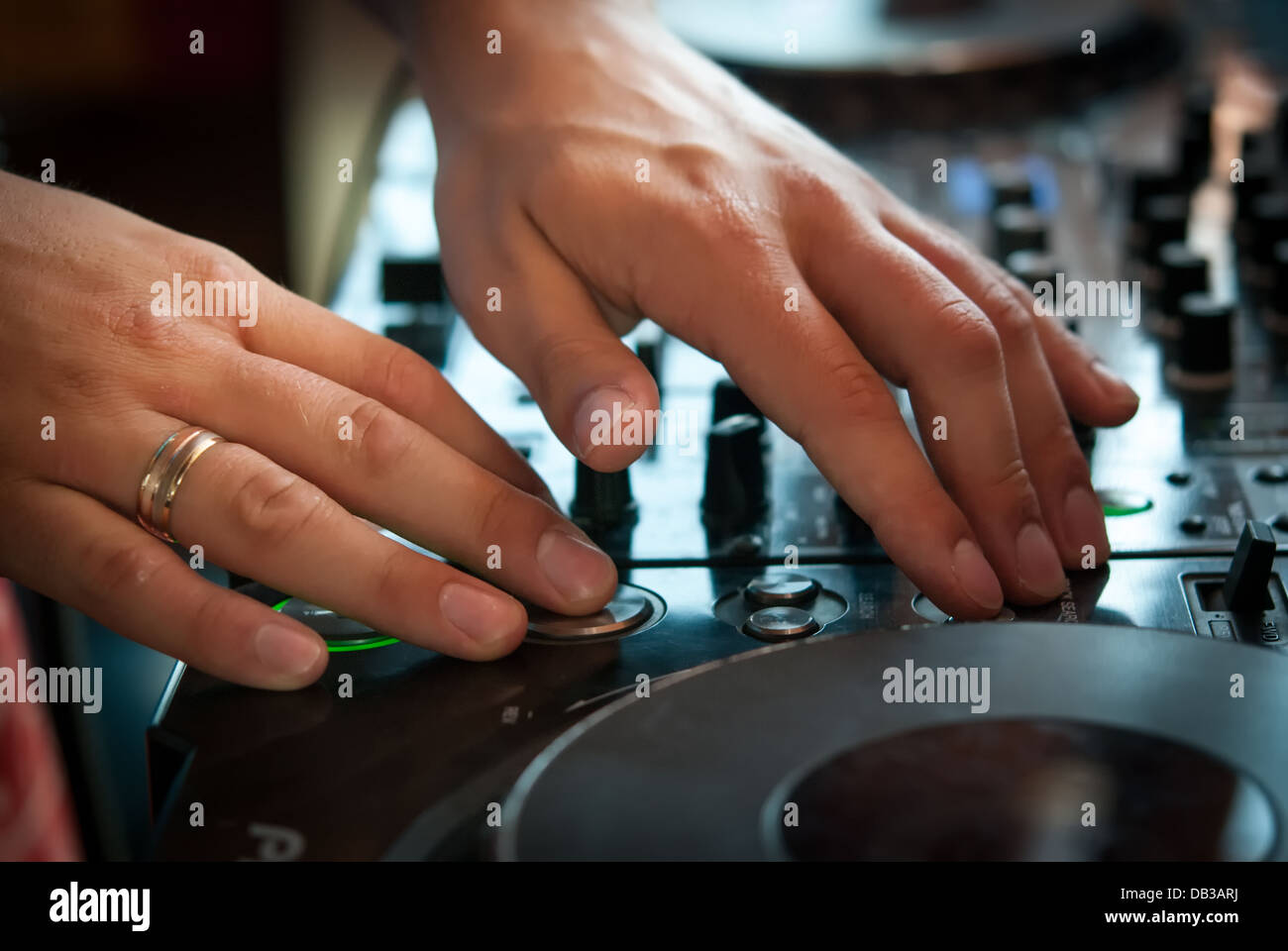 DJ playng on professional mixing controller Stock Photo - Alamy