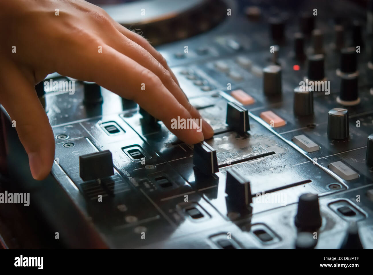 DJ playng on professional mixing controller Stock Photo - Alamy