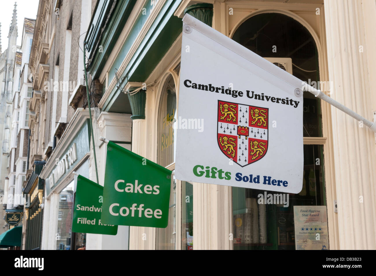 Signs advertising Cambridge University gifts cakes and coffee outside ...