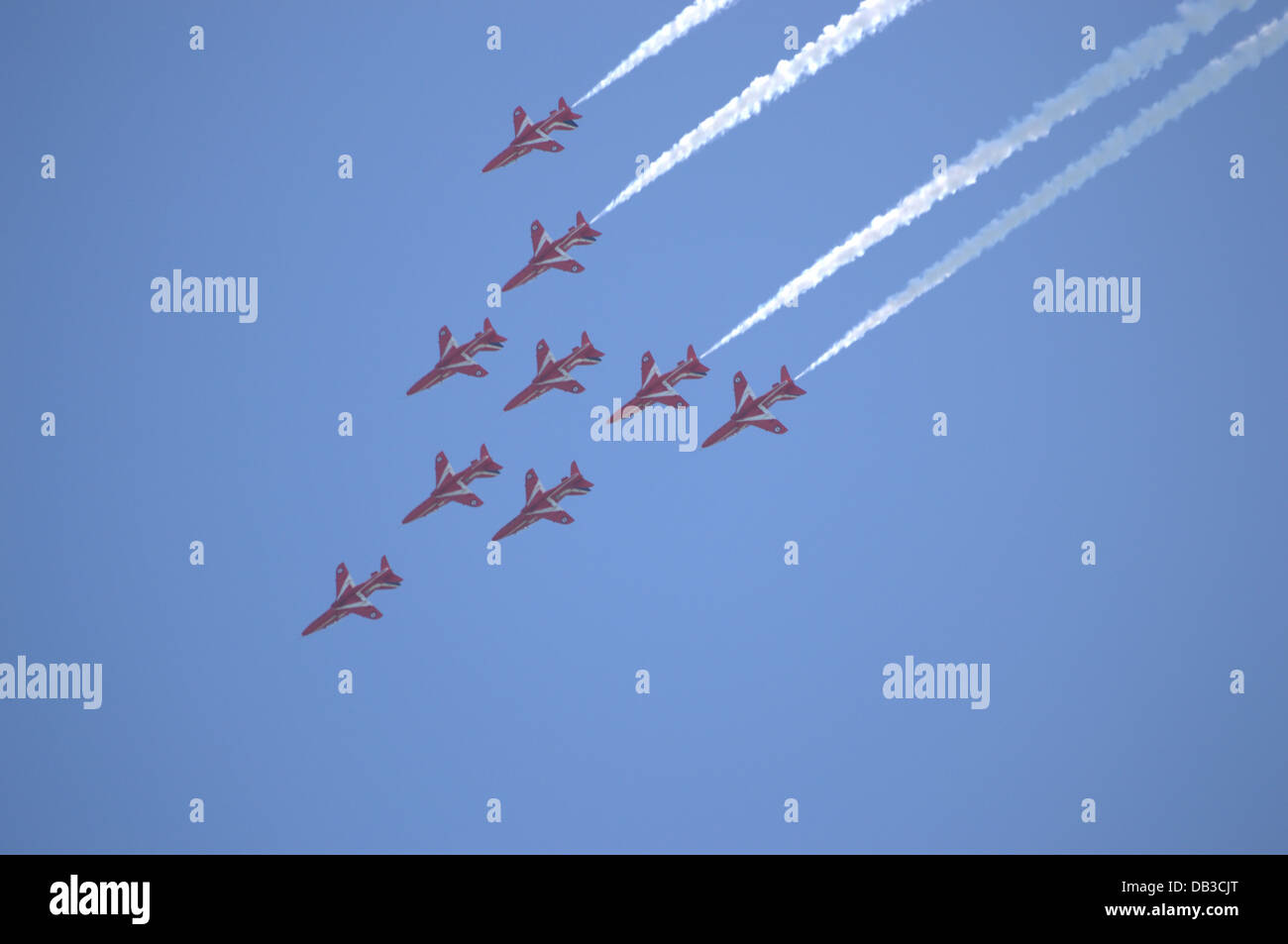 The RAF Red Arrows doing a Eagle formation Stock Photo - Alamy