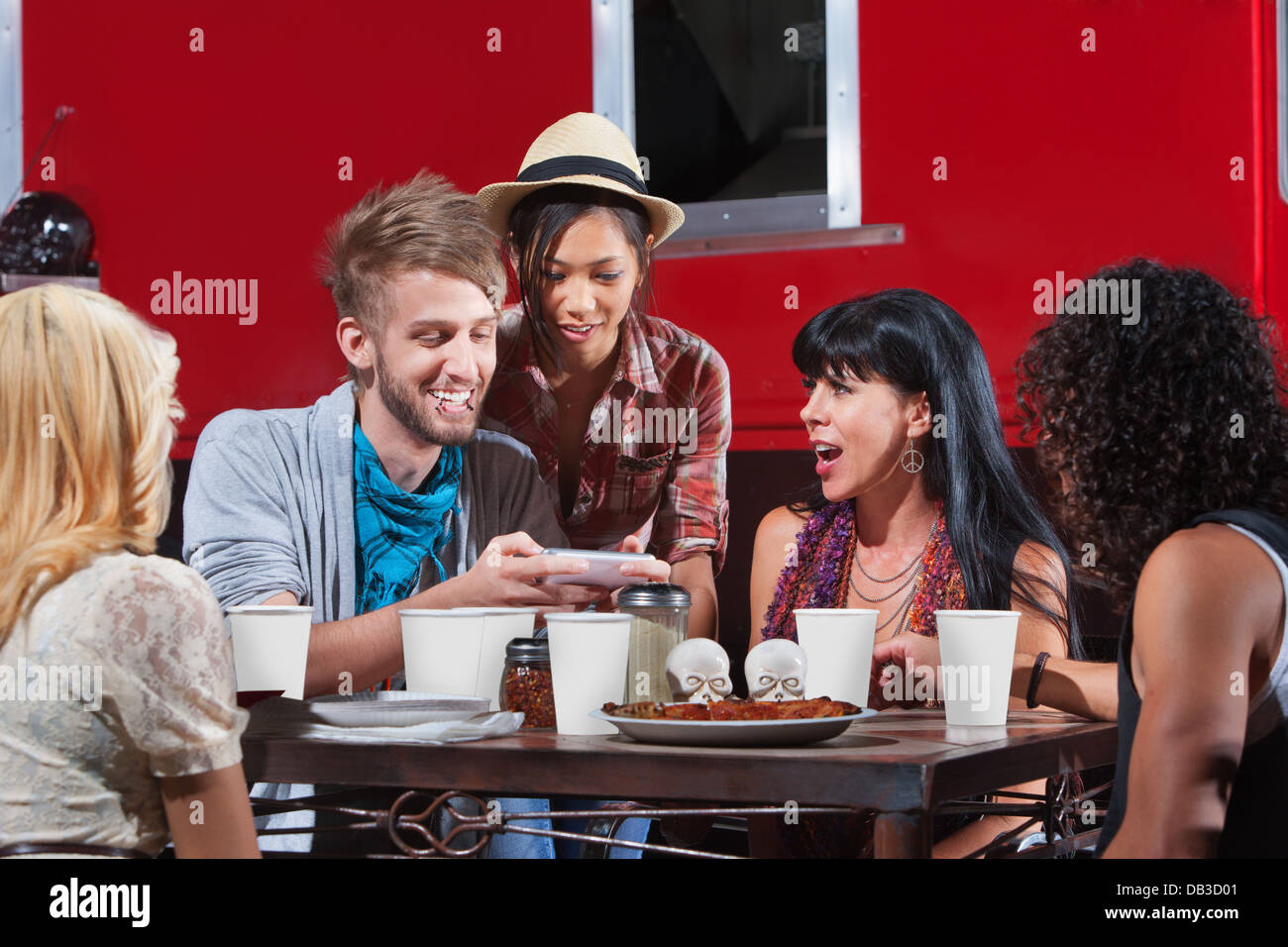 Friends Looking at Text Messages Stock Photo - Alamy