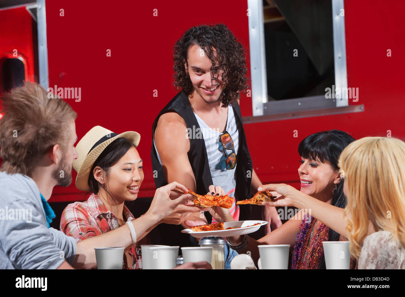 People Sharing Pizza Stock Photo - Alamy