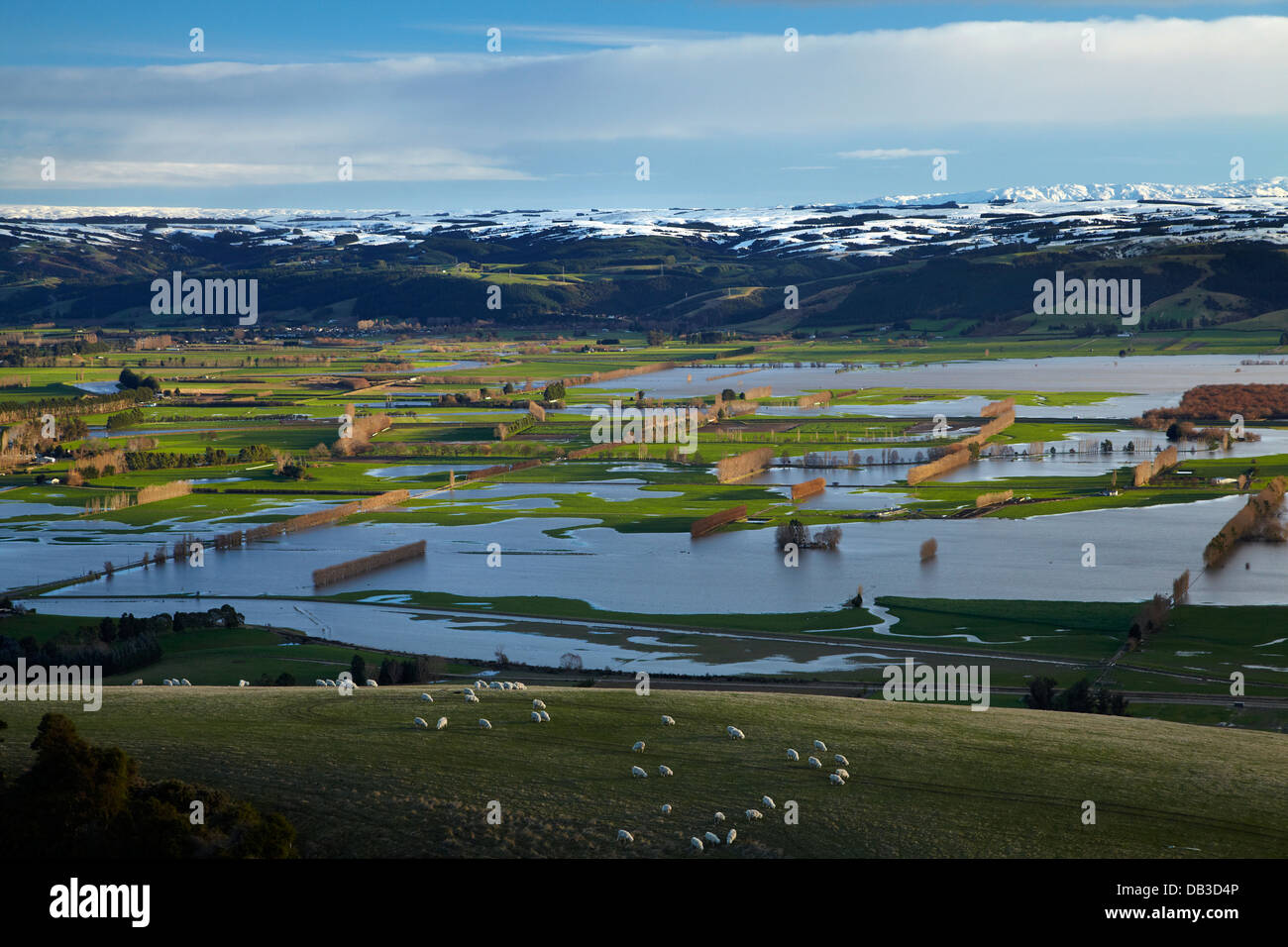 Flooded farmland on Taieri Plains, and snow on Maungatua, near Mosgiel ...