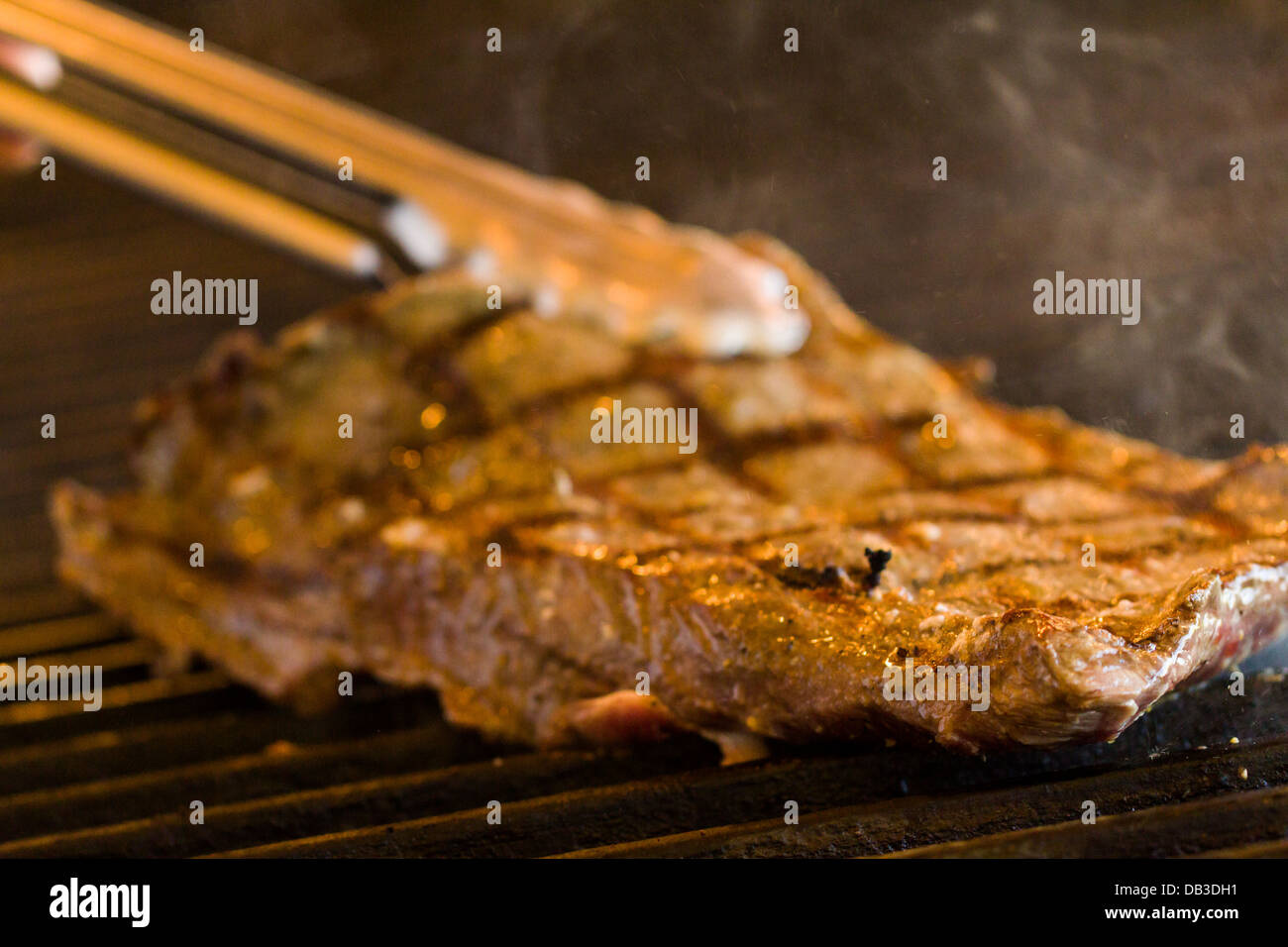 Slice of beef on barbecue grill Stock Photo - Alamy