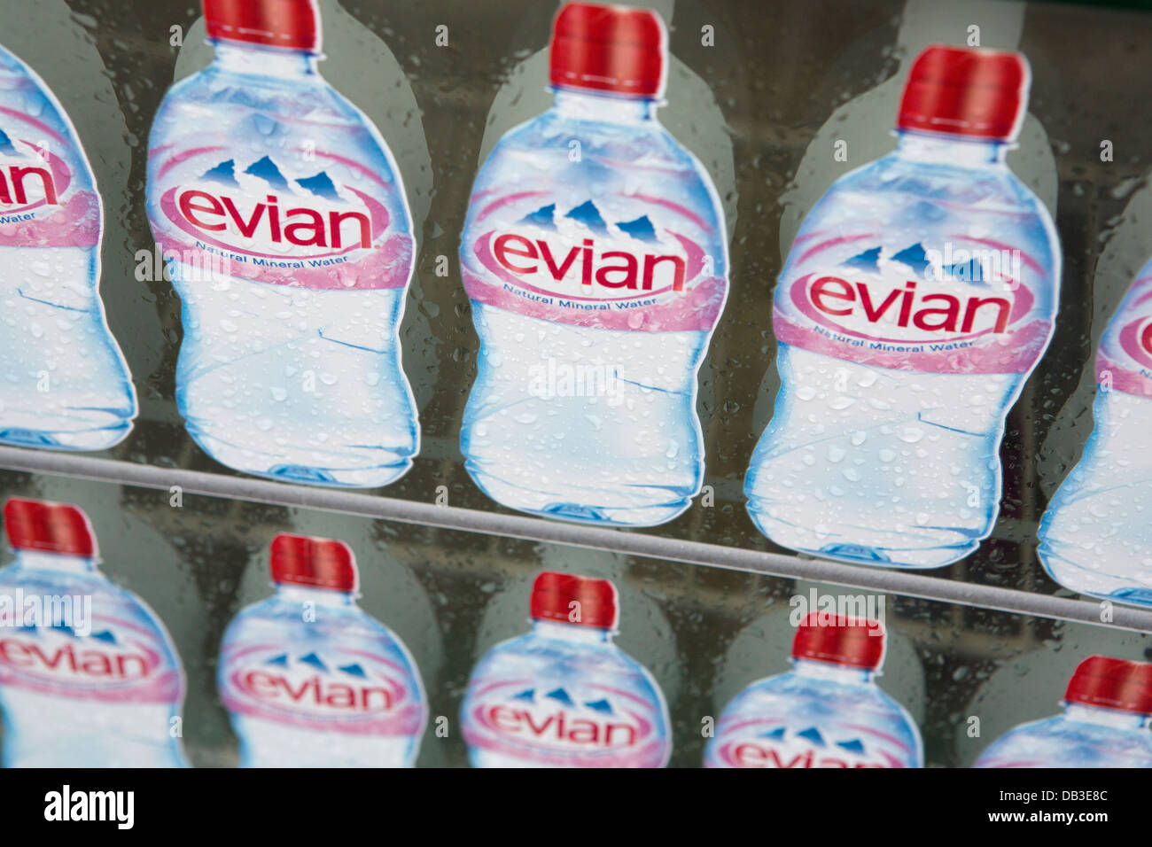 Fridge display of Evian water bottles Stock Photo - Alamy