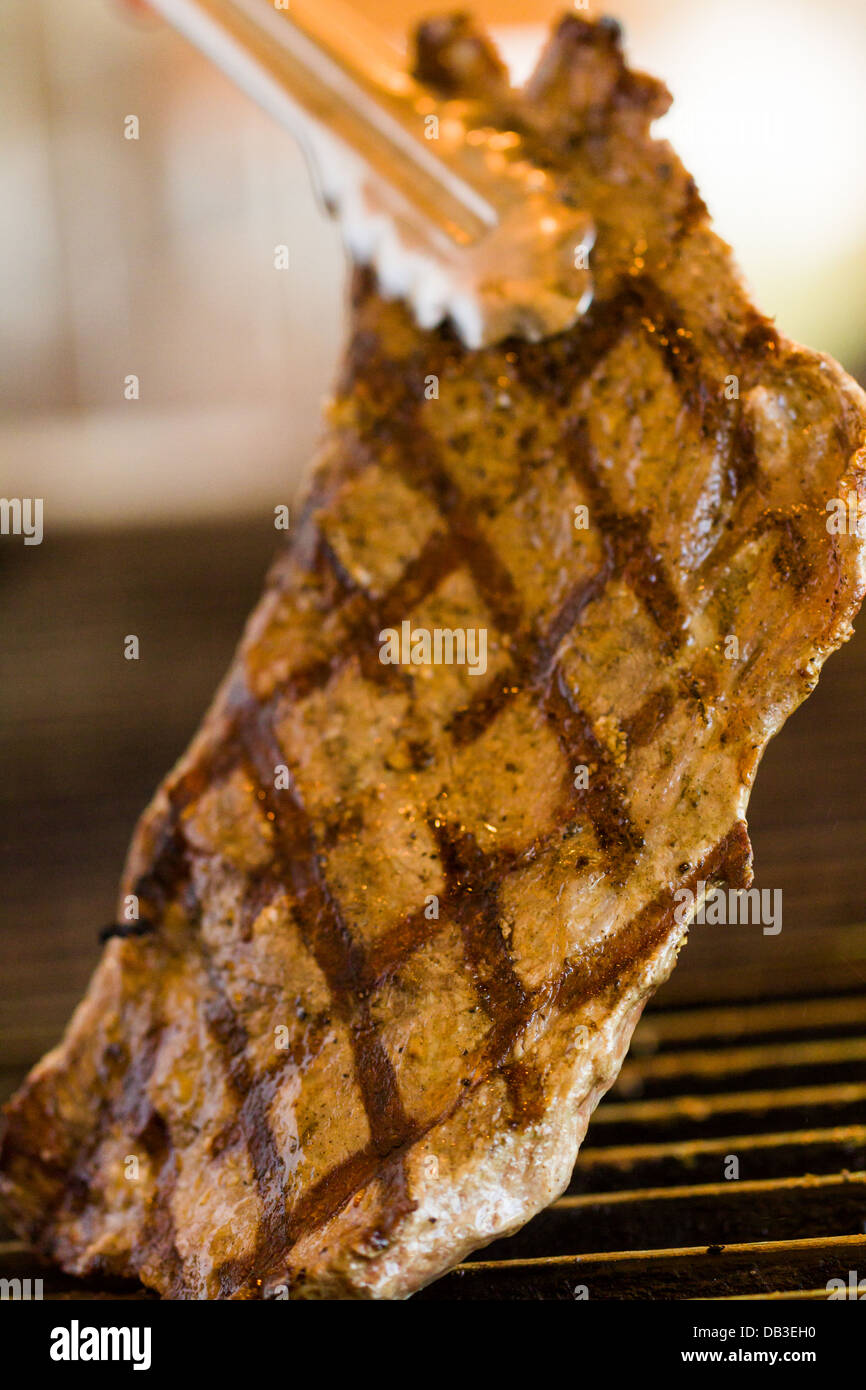 Slice of beef on barbecue grill Stock Photo - Alamy