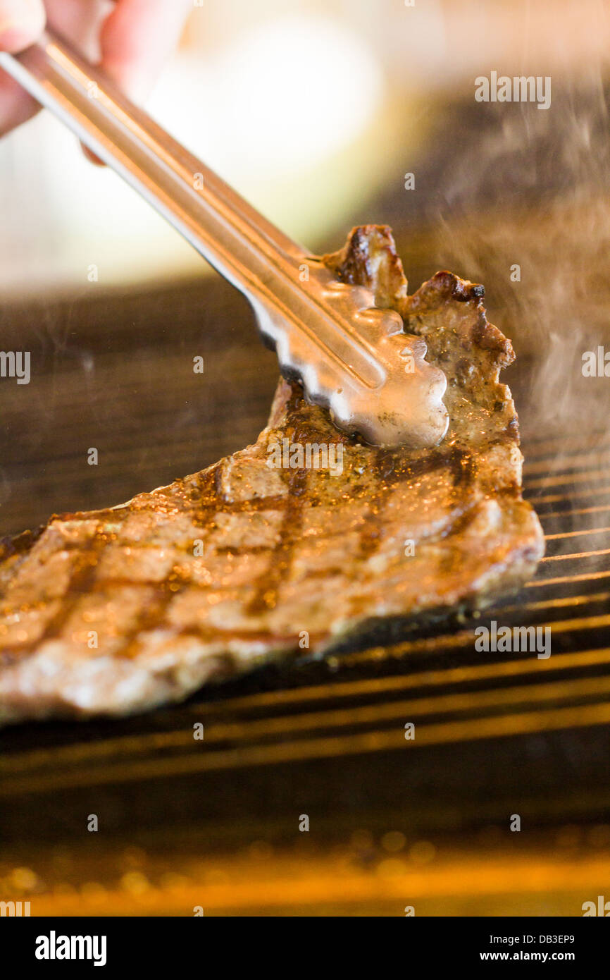 Slice of beef on barbecue grill Stock Photo - Alamy