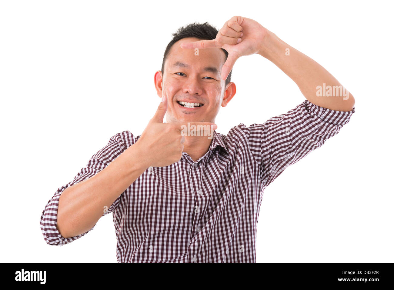 Finger frame. Smiling Asian business man making a frame with fingers ...