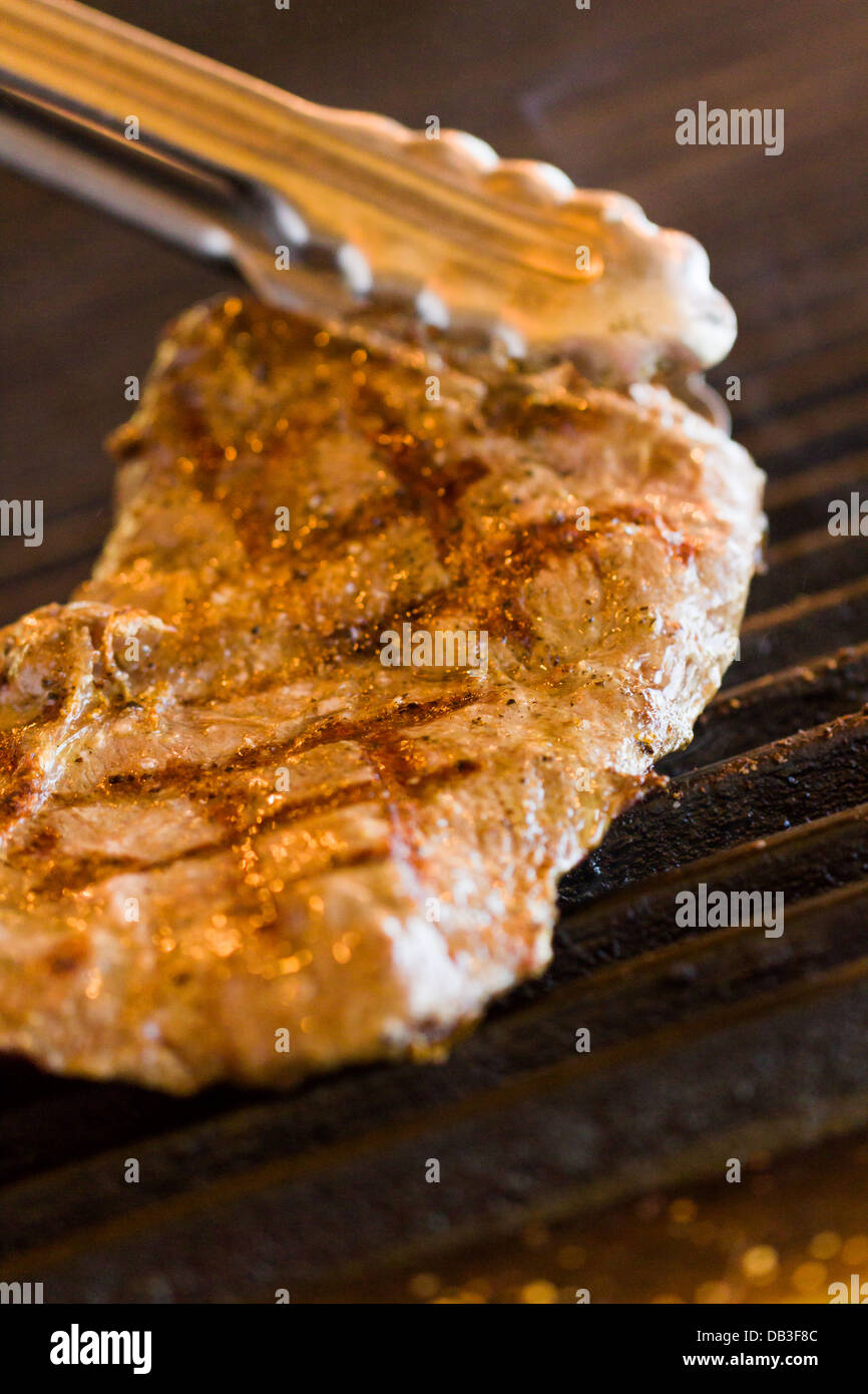 Slice of beef on barbecue grill Stock Photo - Alamy