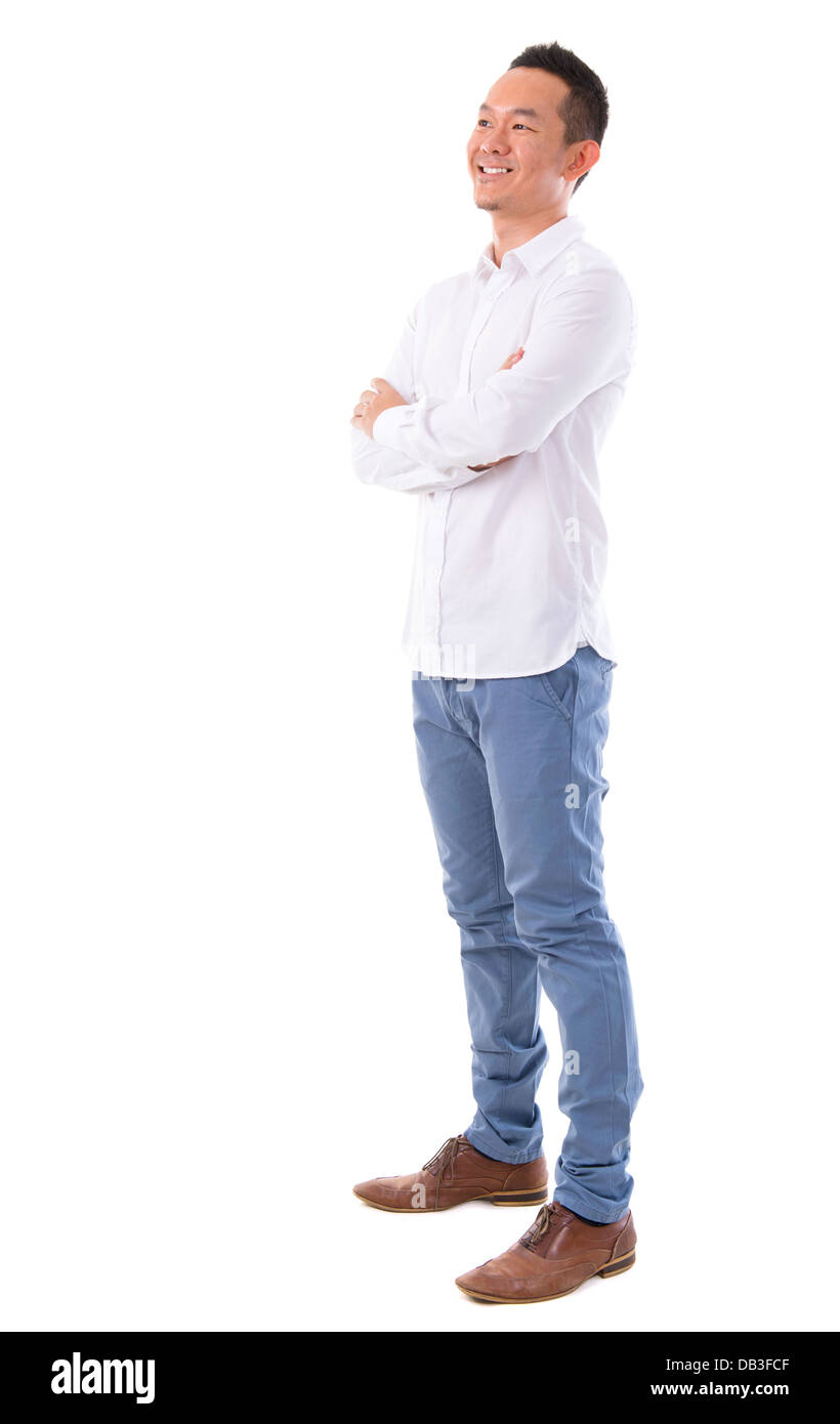 Front view full body happy Asian man looking at side standing isolated ...