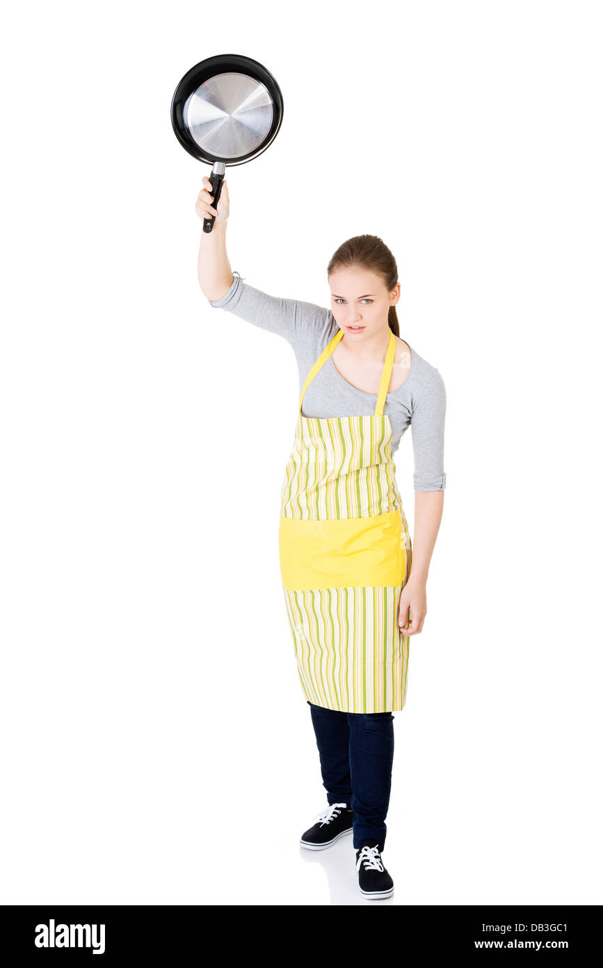 Angry young woman cooking , isolated on white Stock Photo - Alamy