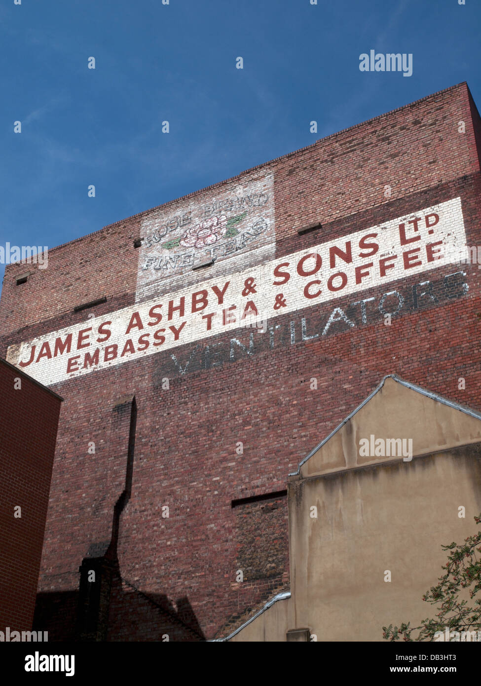 An old business sign on the side of a building in London Stock Photo ...