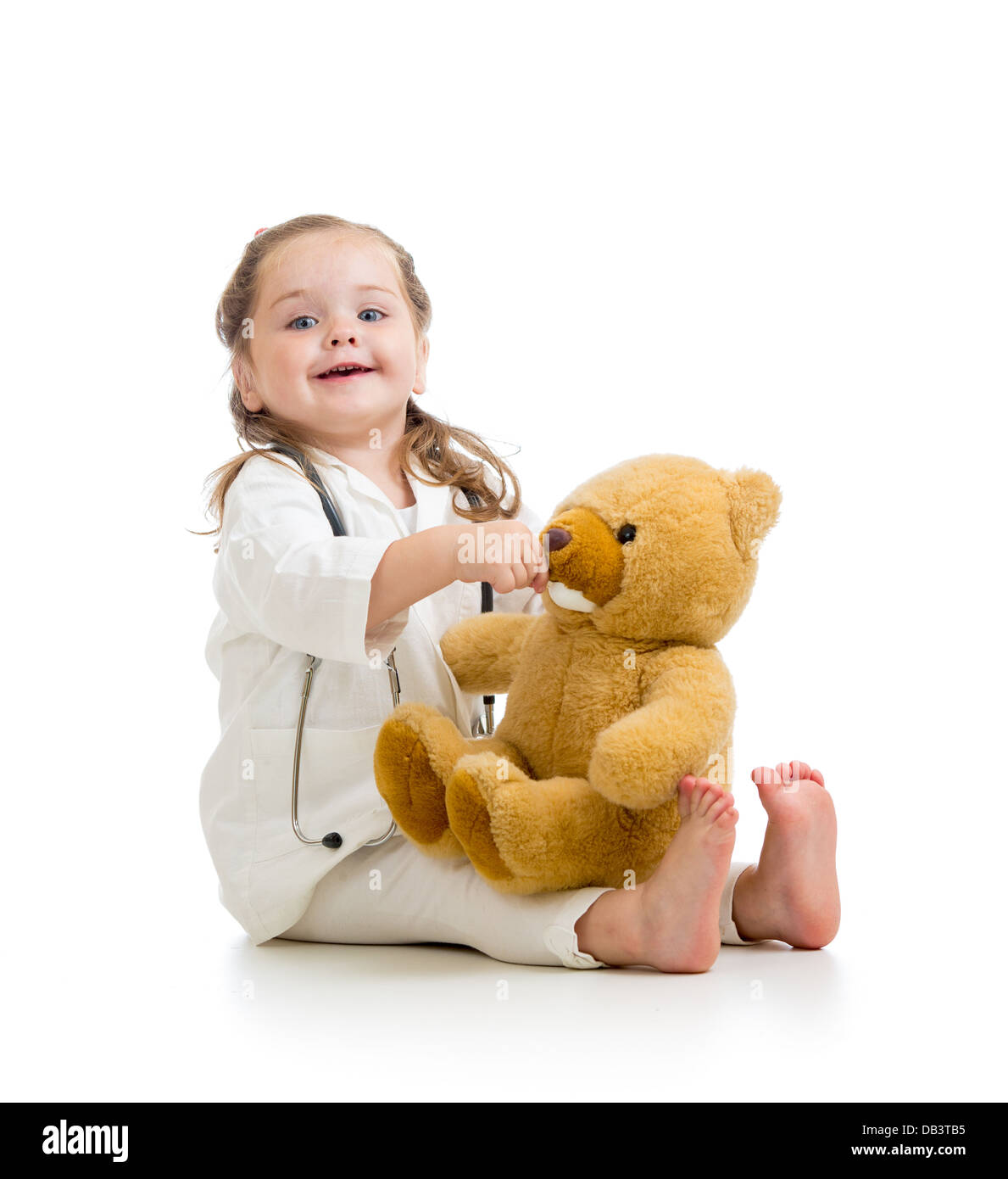kid girl playing doctor with toy Stock Photo - Alamy